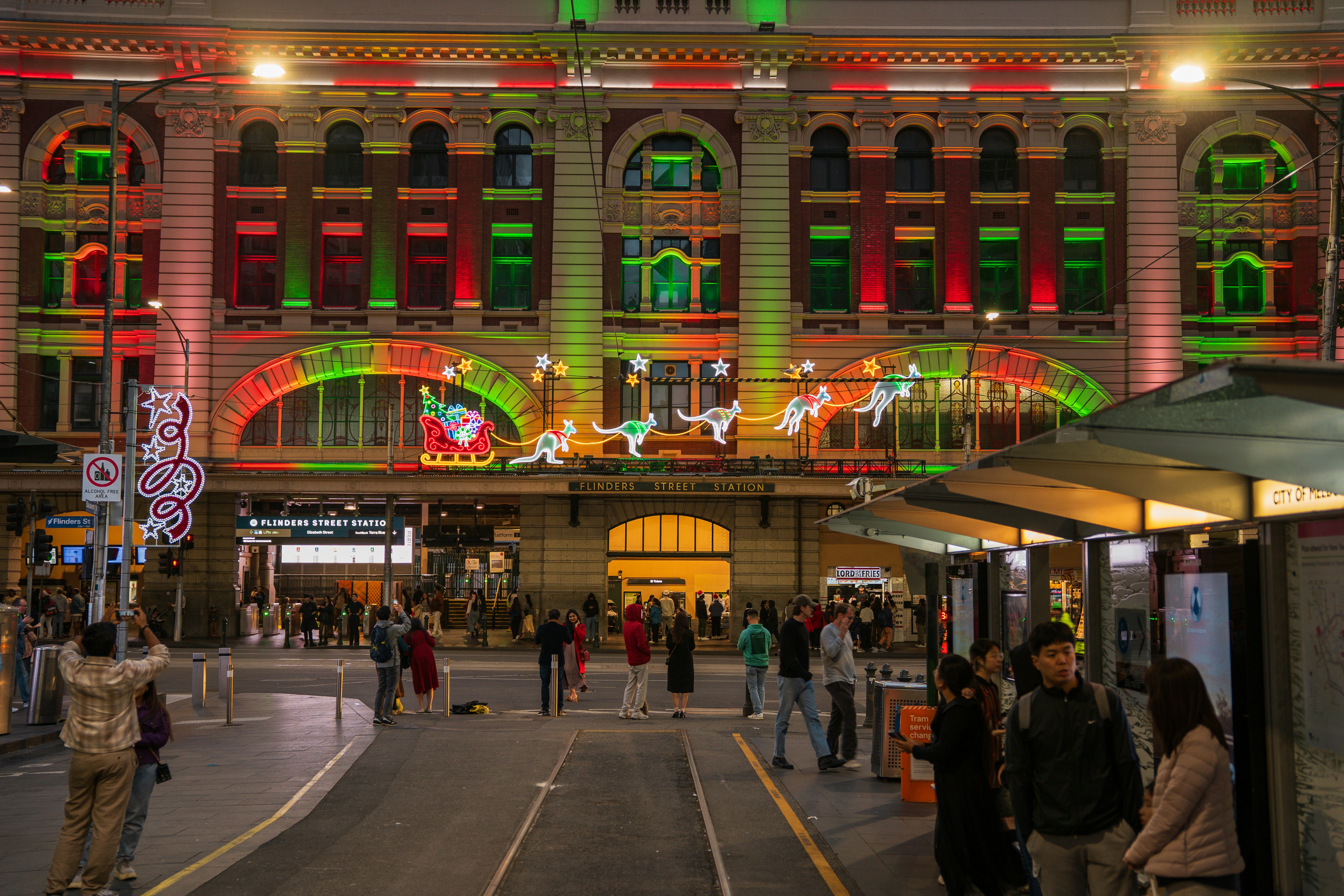 Festive Lights Over a Bustling City Arcade