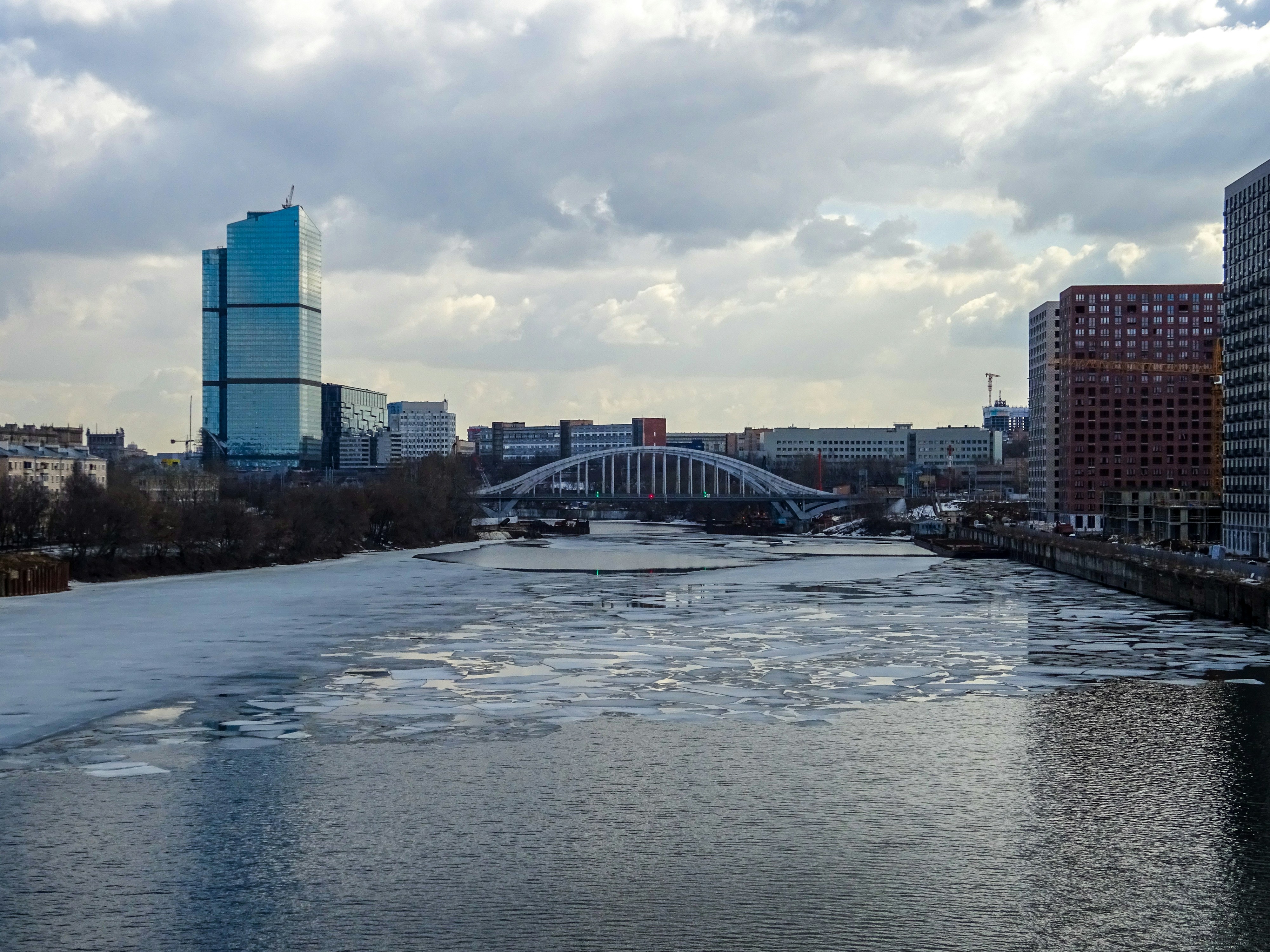 River Arc: Cityscape Bridge and Ice-Cleared Waterfront