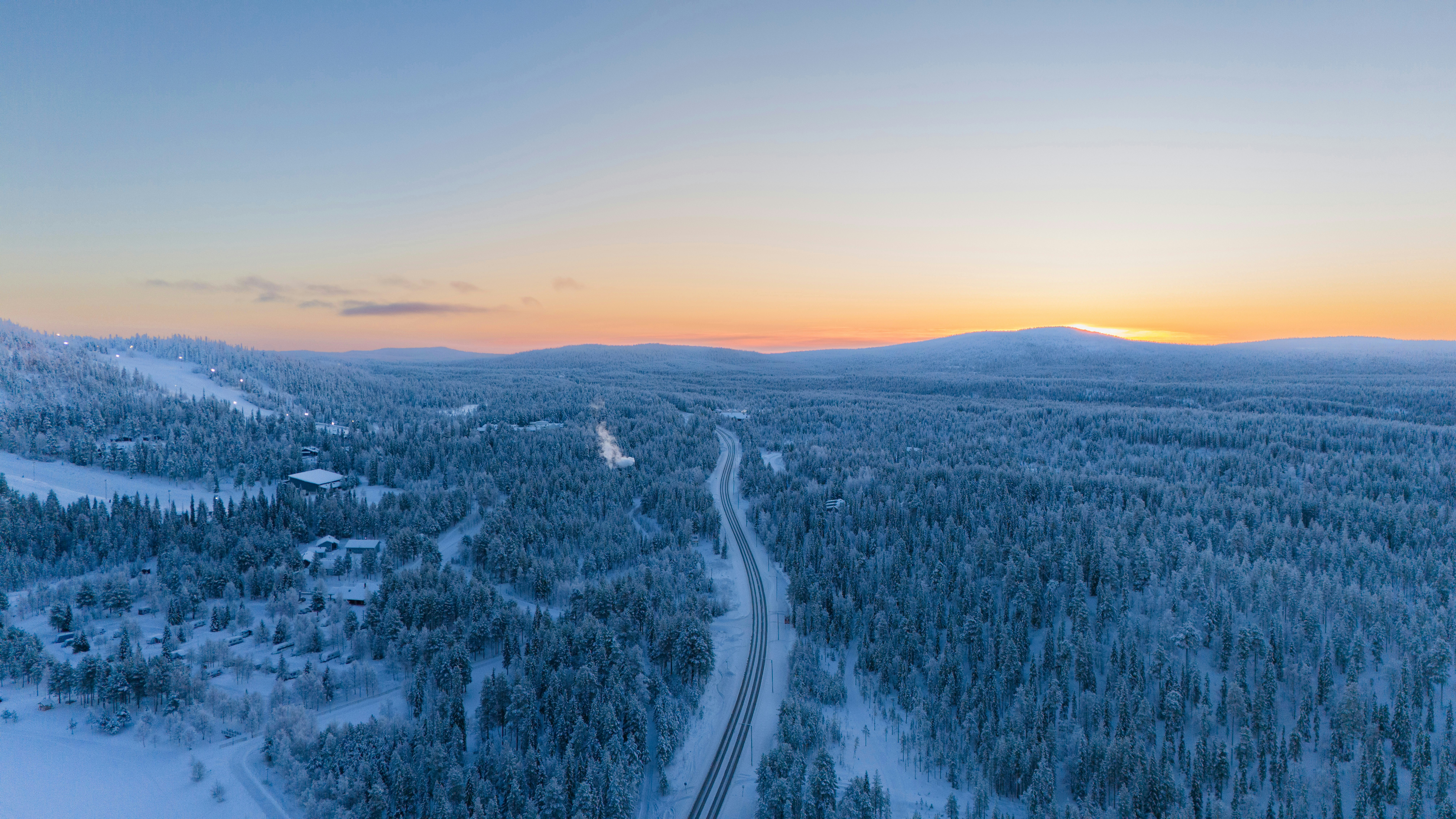 Lonely winter road in the sunset