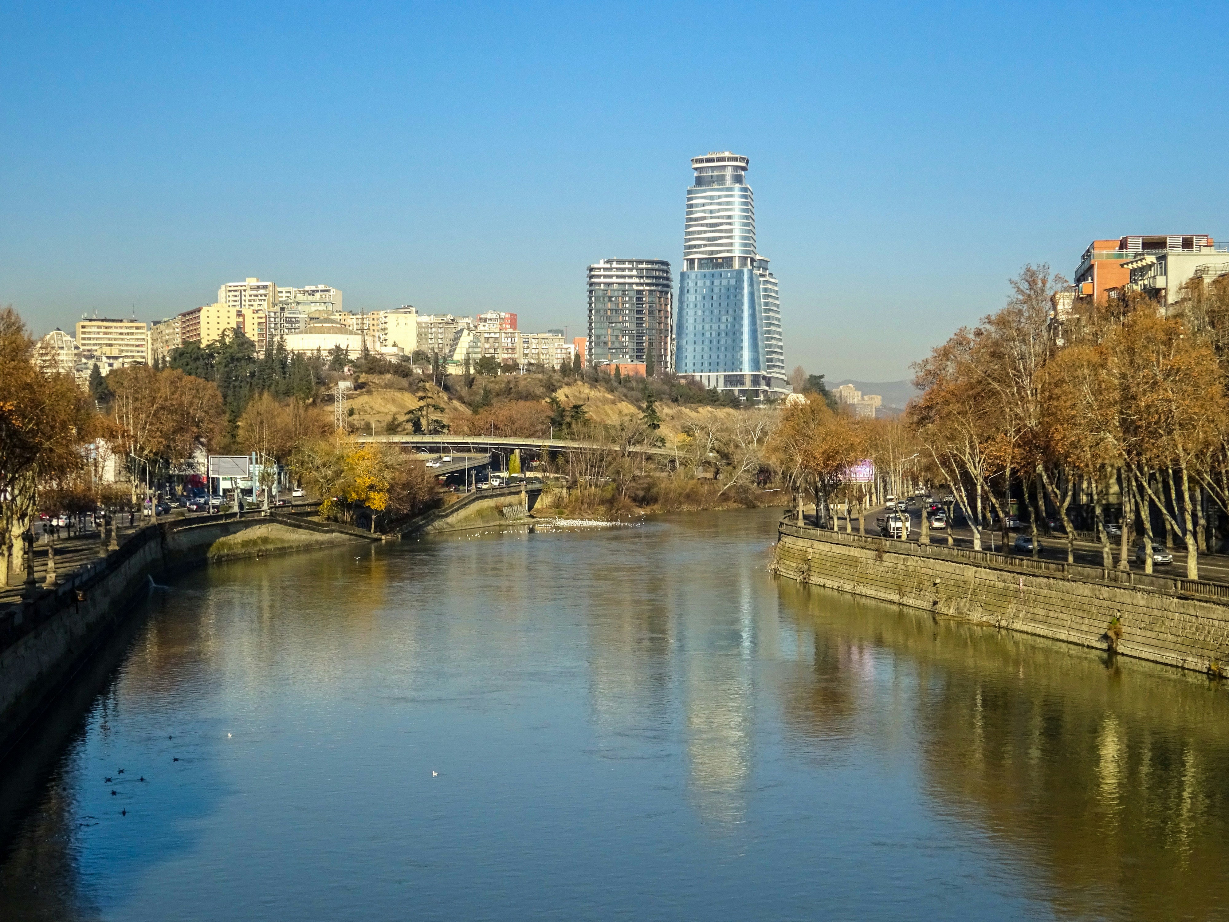 River View with Modern Tower Rising Above a Calm Cityscape