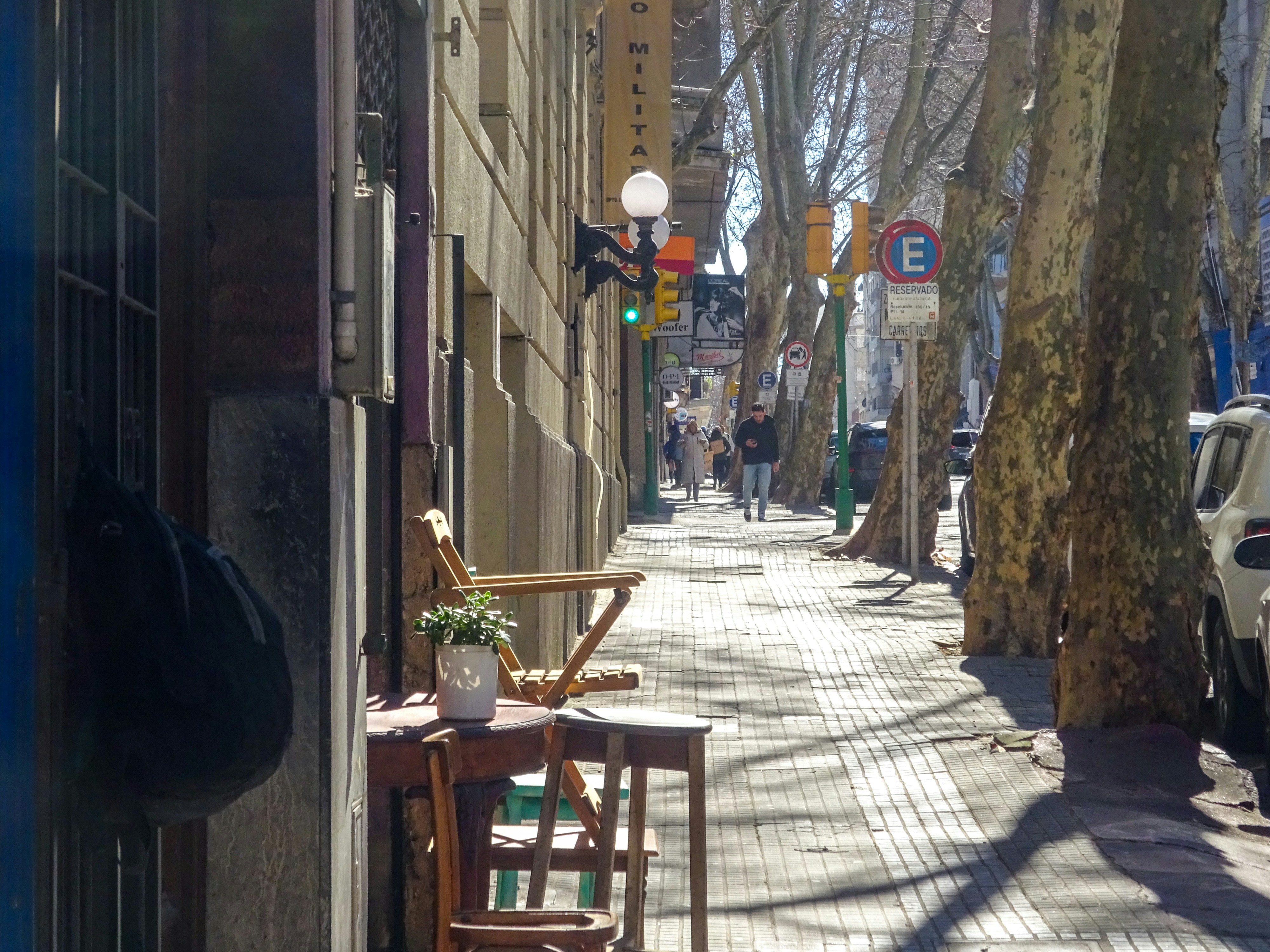 Sunlit Café Alley: A Quiet Urban Stroll