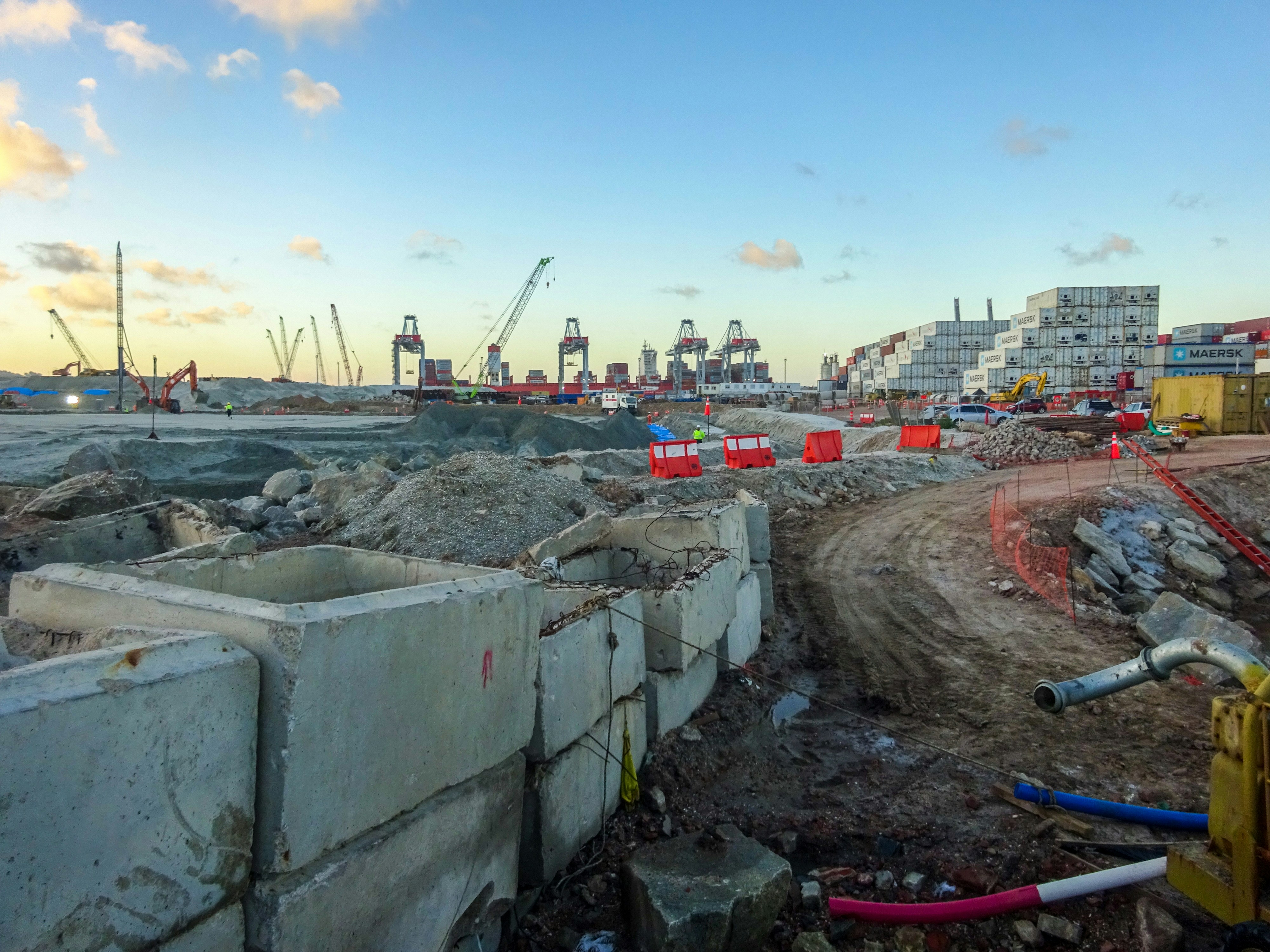Construction site with cranes and concrete blocks