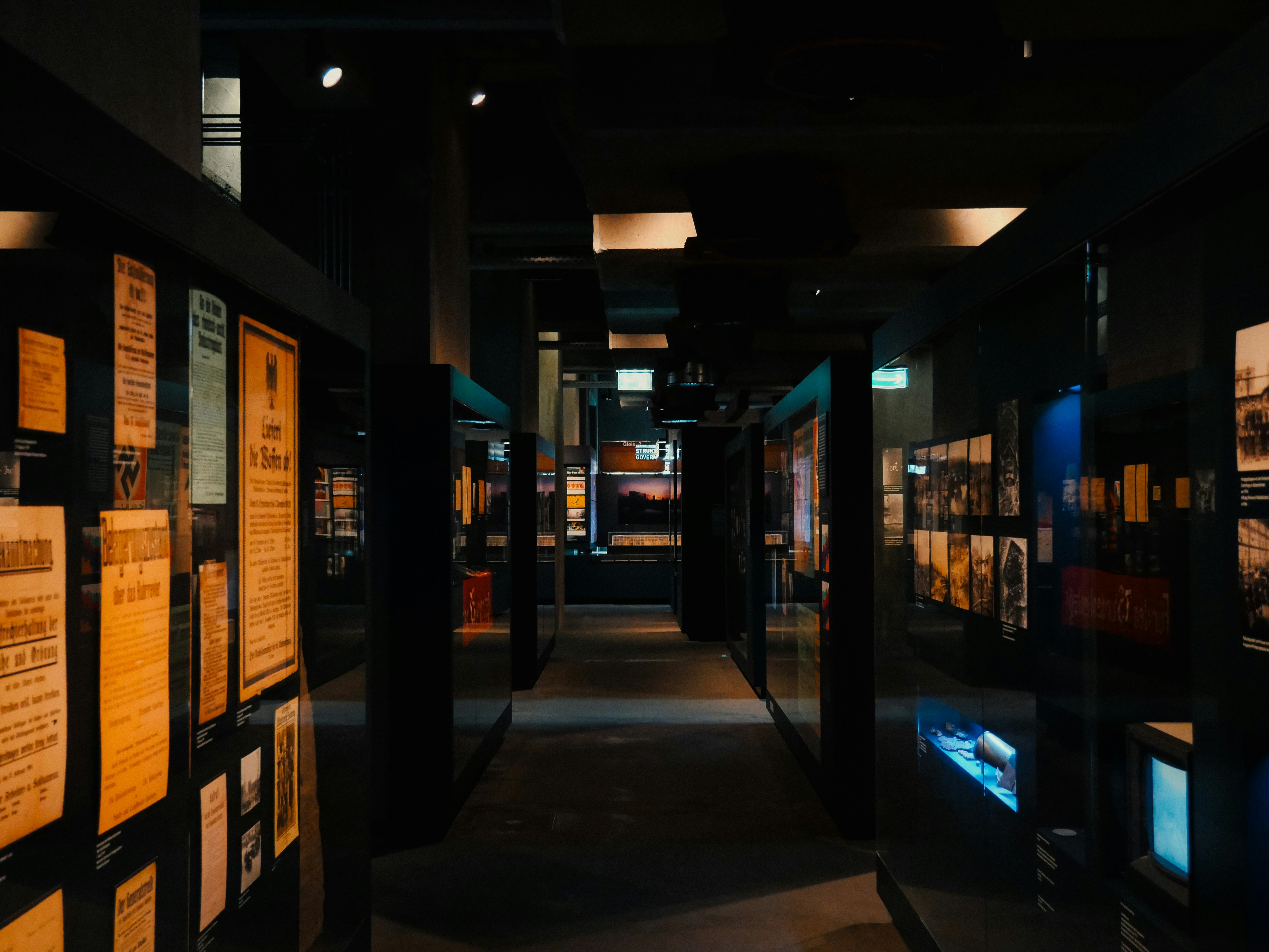 Dark museum hallway with exhibits on walls photo – Free Education Image ...
