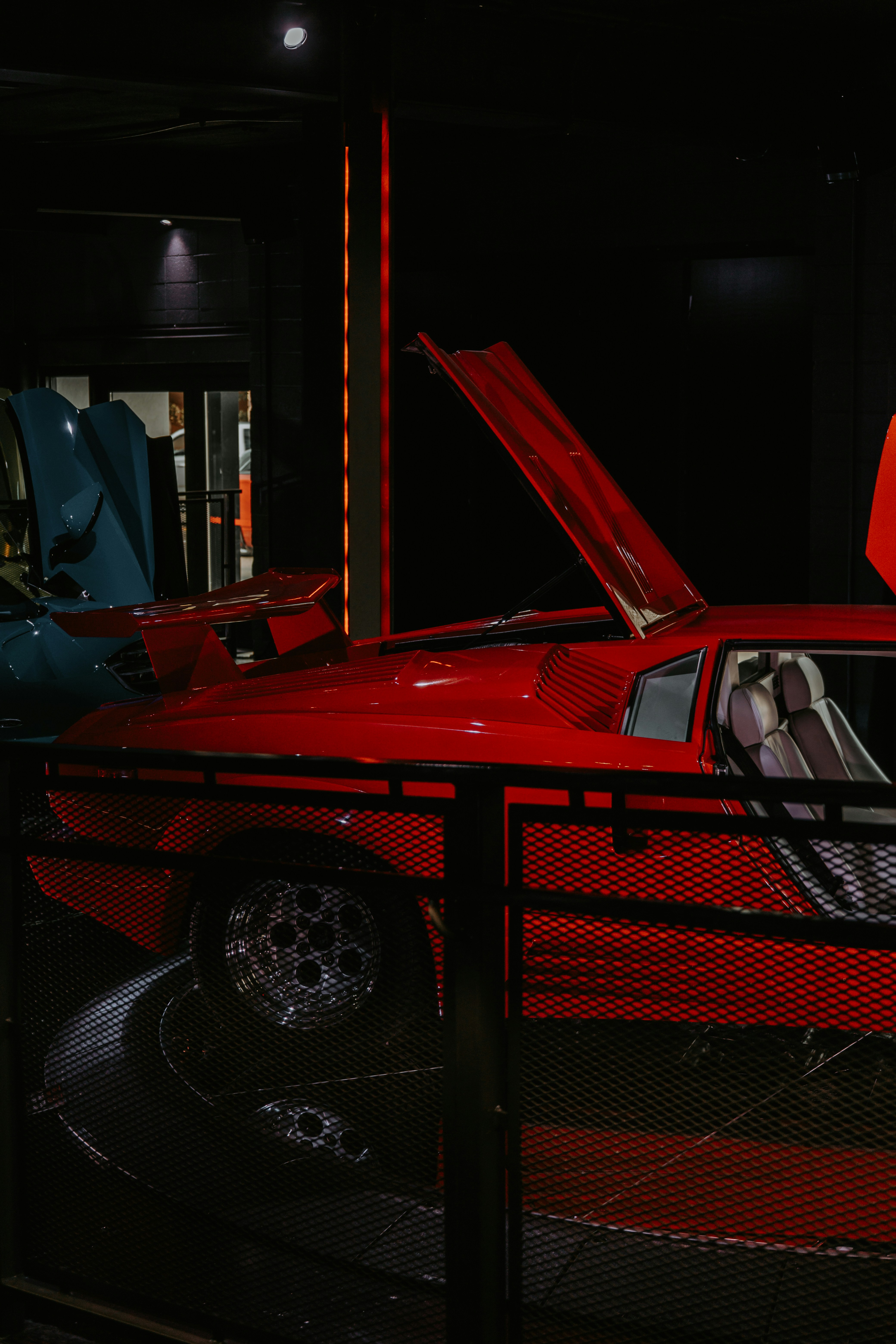 Red Exotica in the Dim Showroom