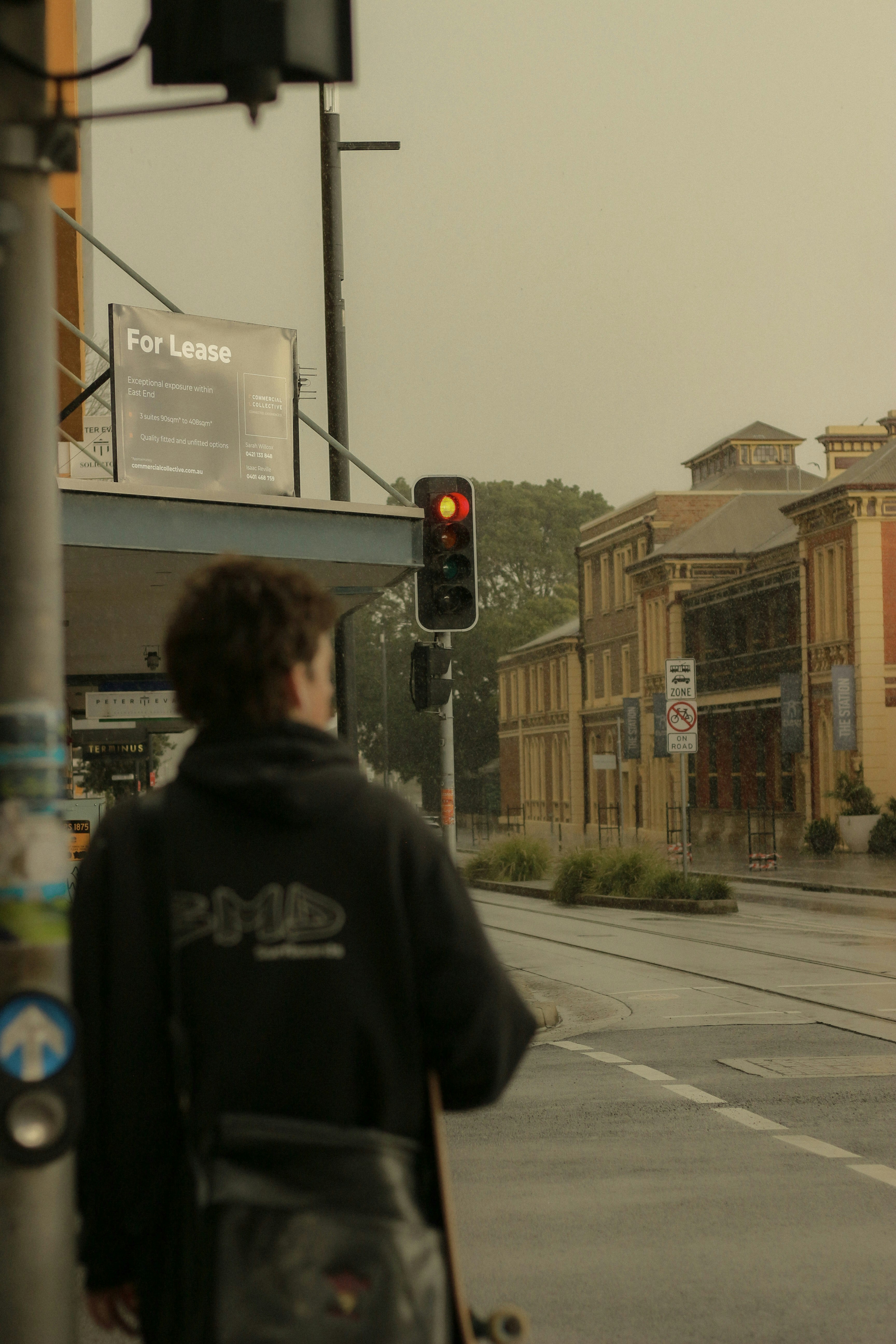 Urban Pause: Red Signal and a Foreigner of the Street