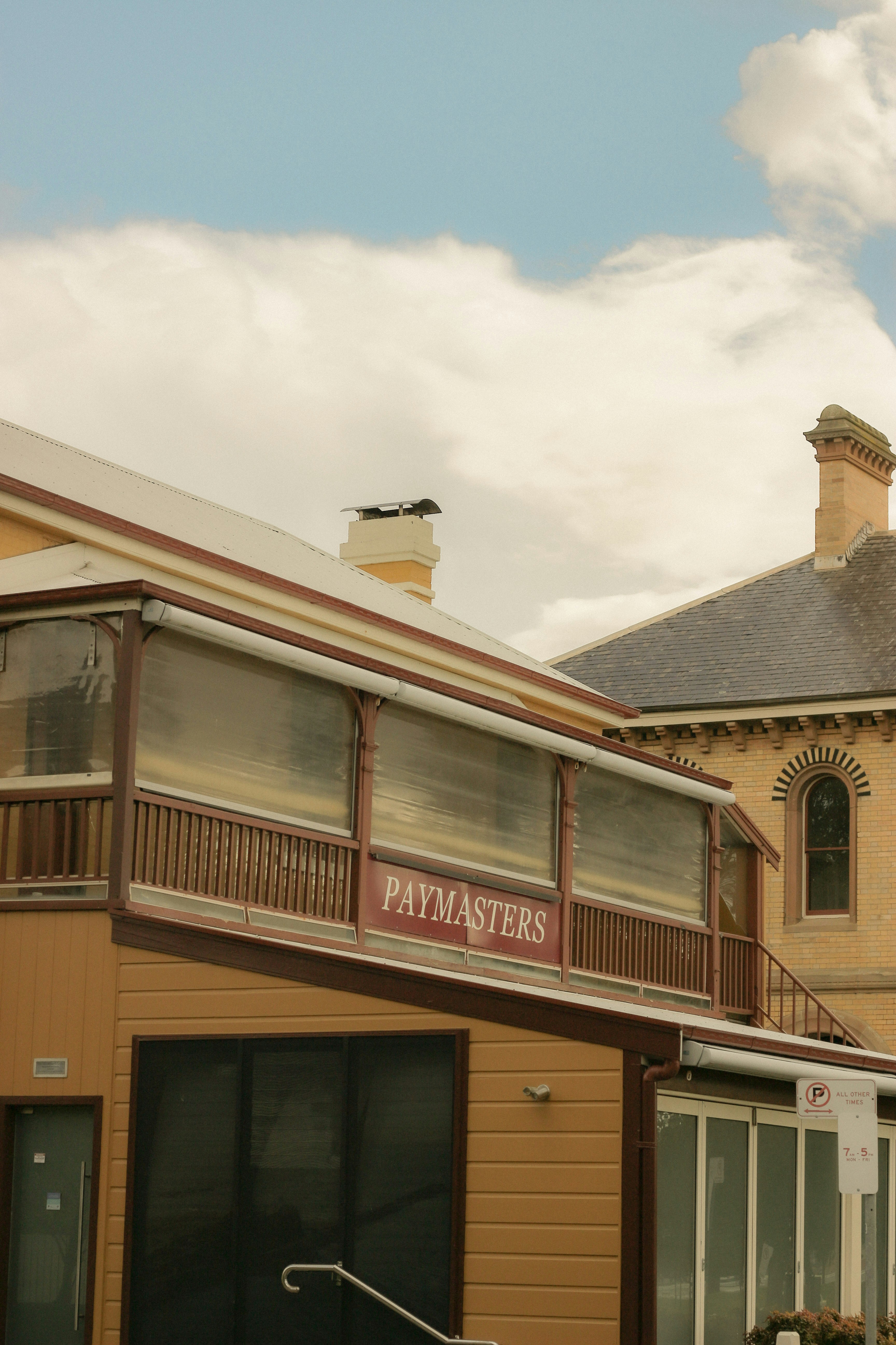 Paymasters Terrace: A Historic Façade Stretching Under Plush Skies