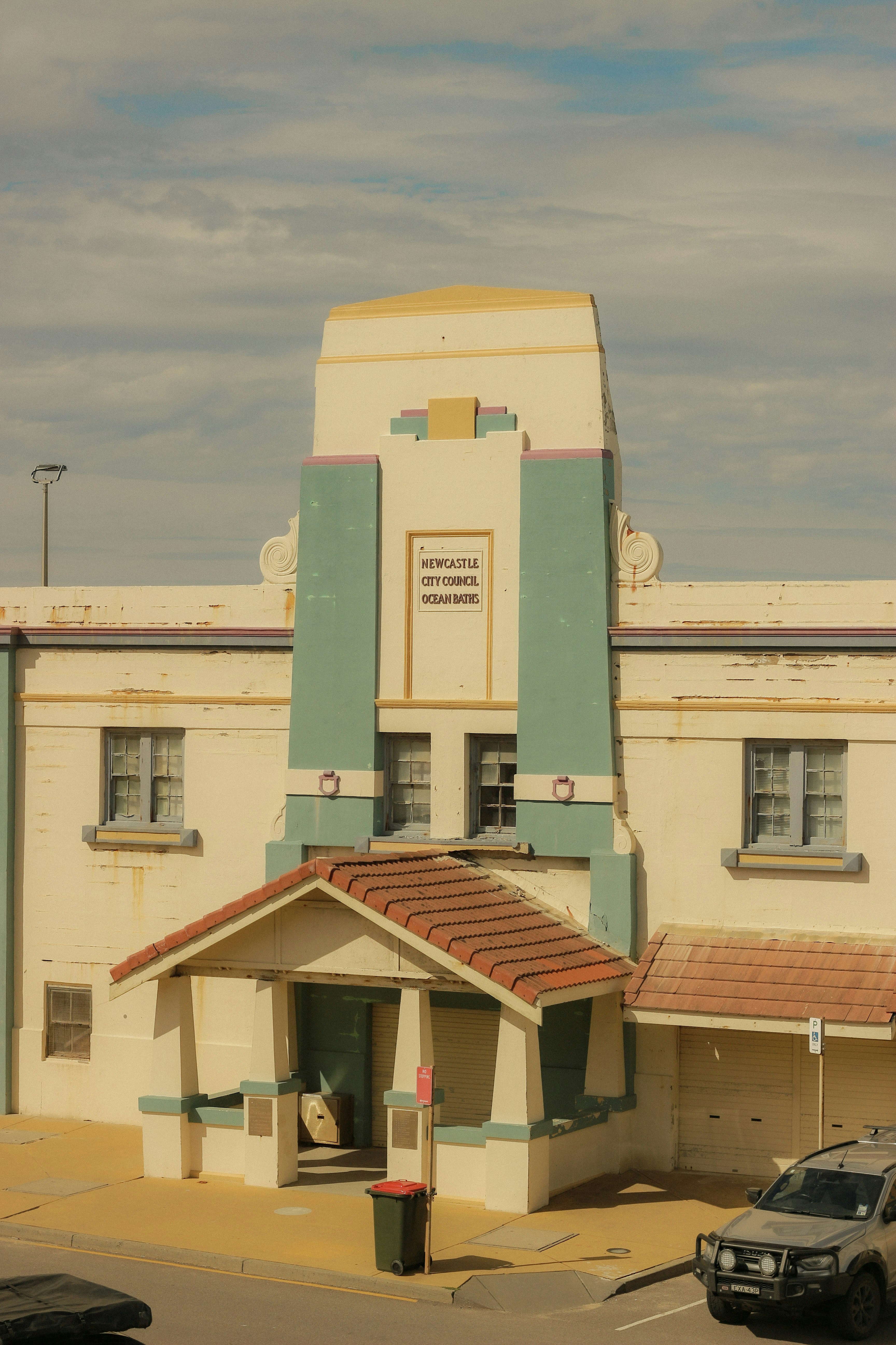 Art Deco Facade: Sunset-Tinted Theatre of Colorful Vertical Ribbons