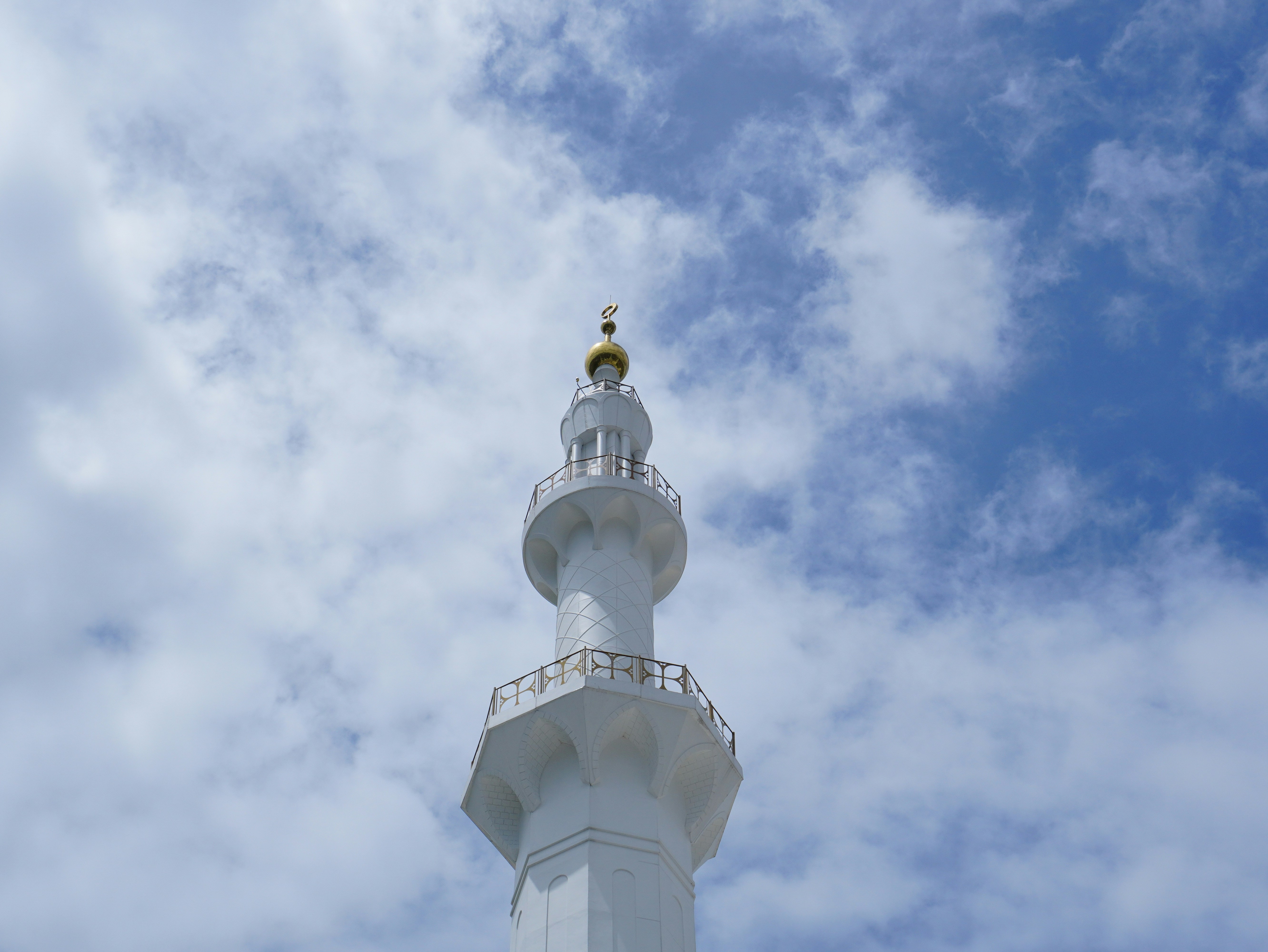 White Minaret Reaching Toward a Blue Sky