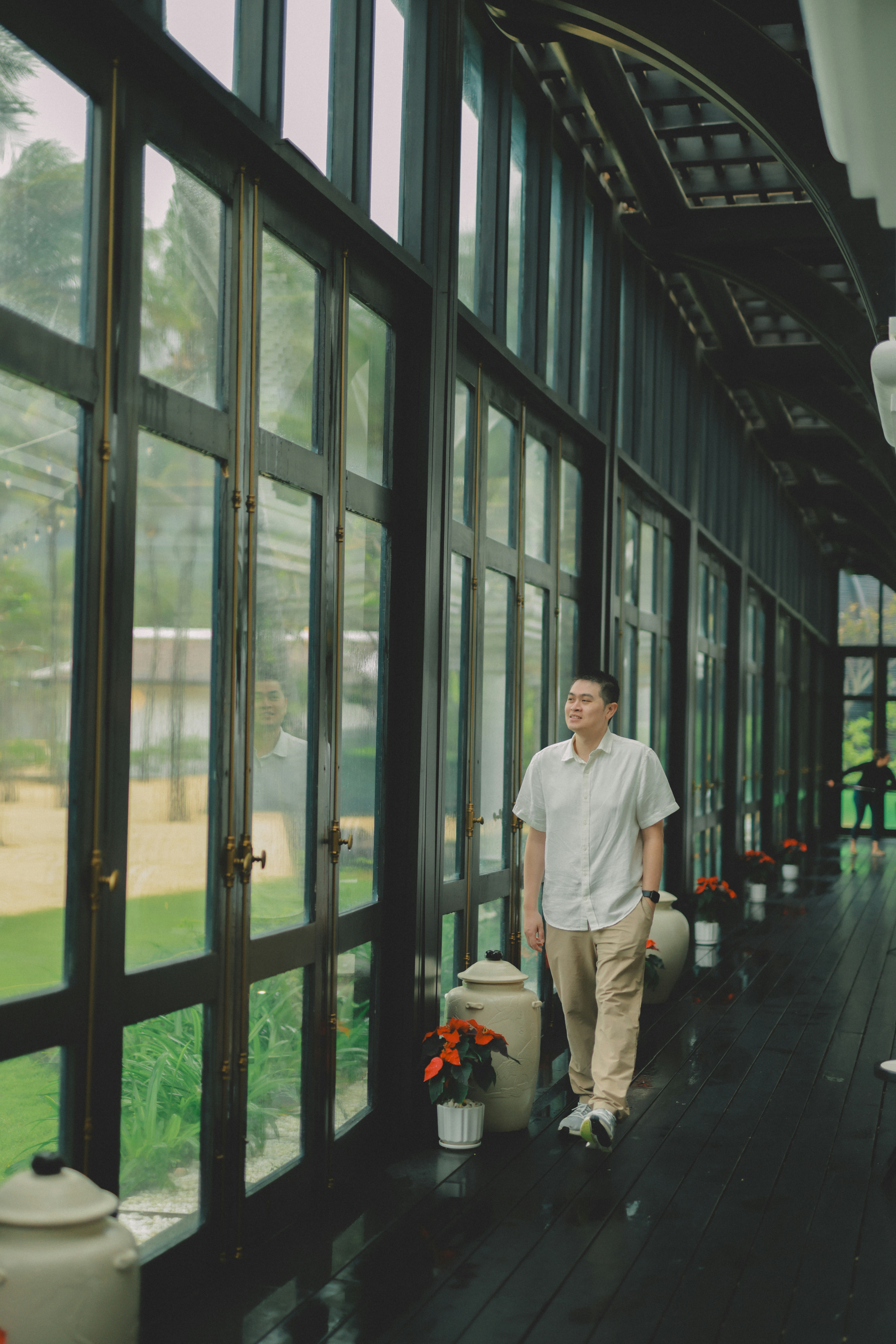 Wardrobe in Reflection: A Quiet Walk Along a Glass Corridor