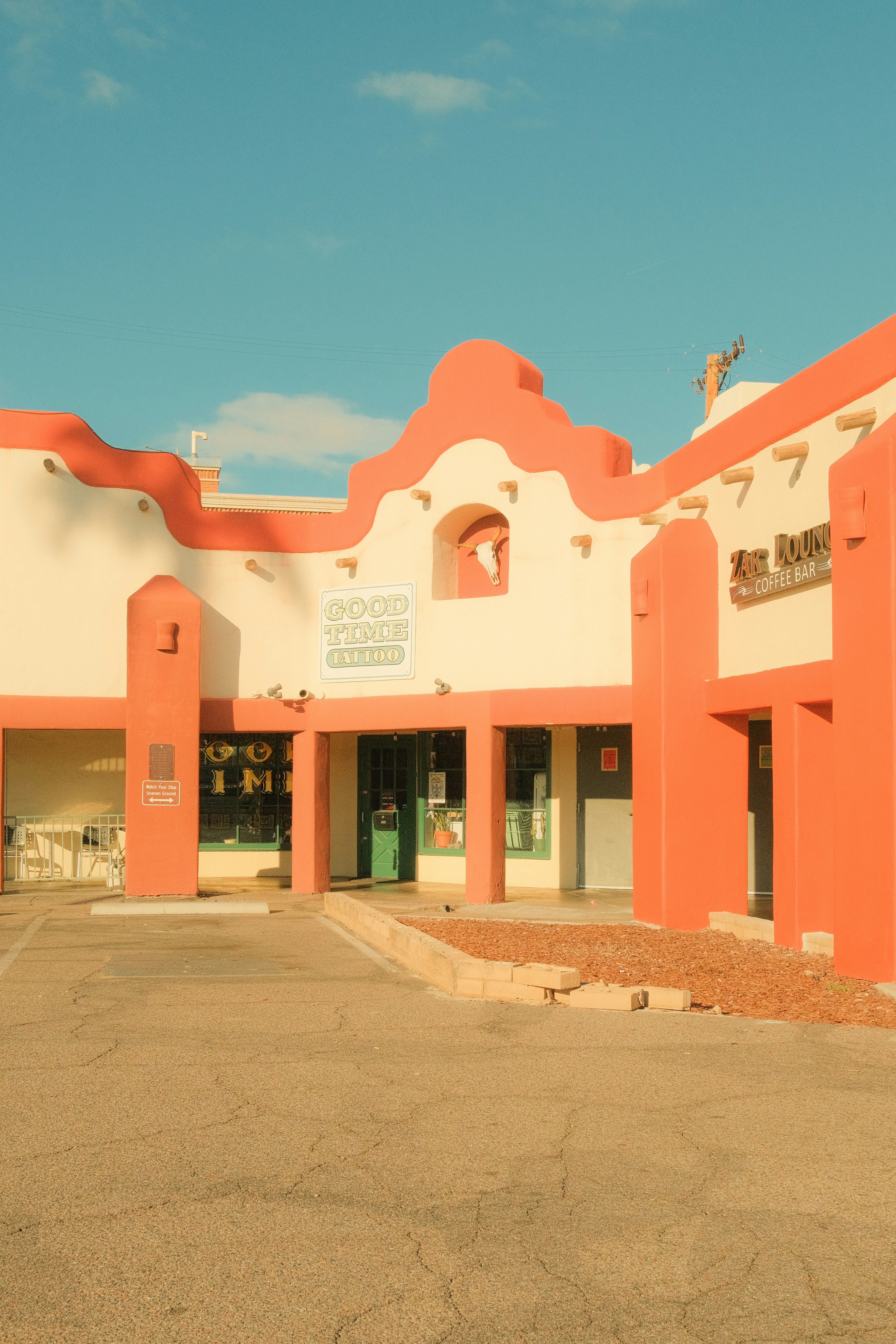 Desert-Mun Red Facade: A Sunny Courtyard Arcade
