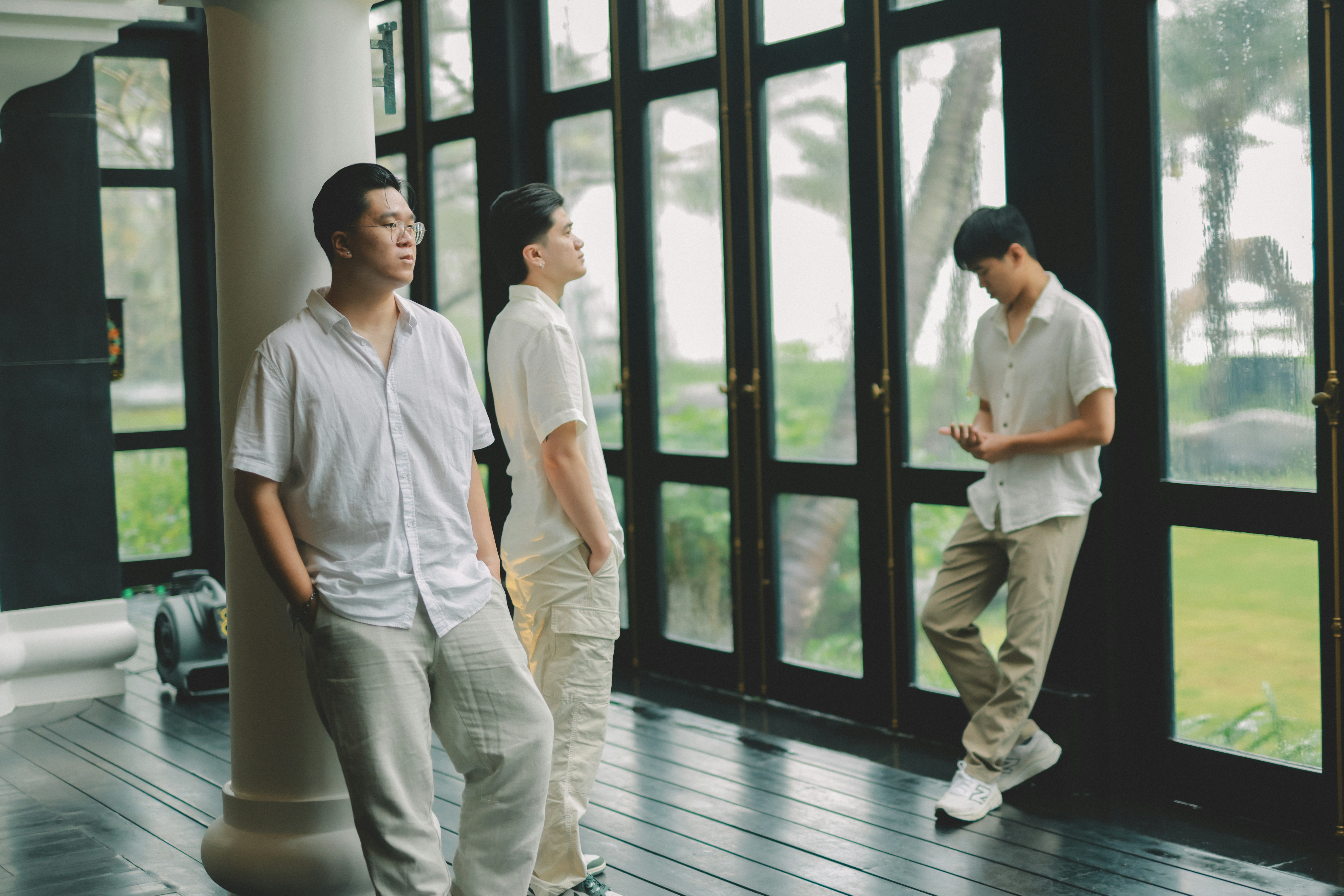 Quiet Reflections by the Window: Three Minds in Soft Light