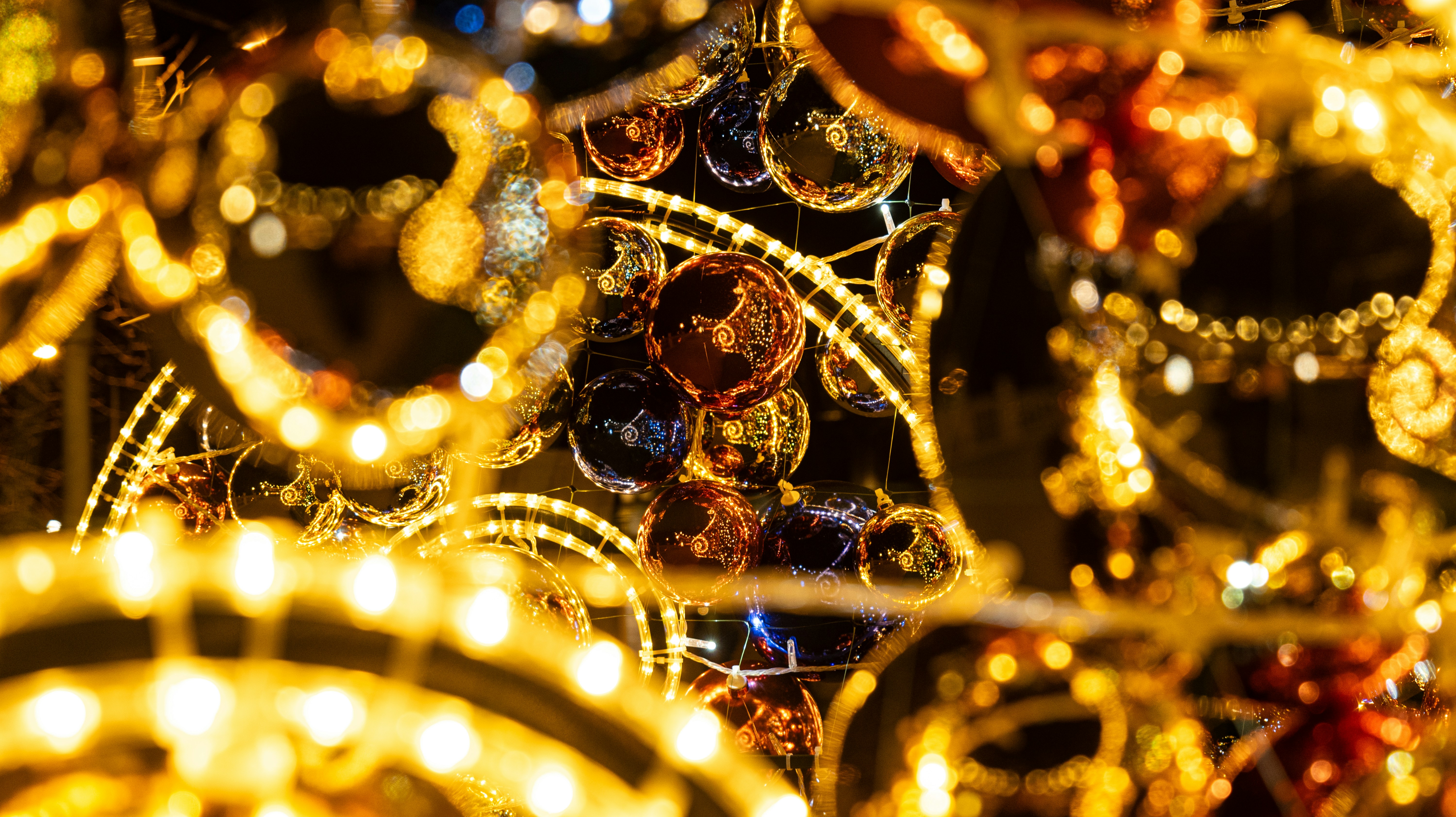 Golden christmas lights illuminate intricate decorations