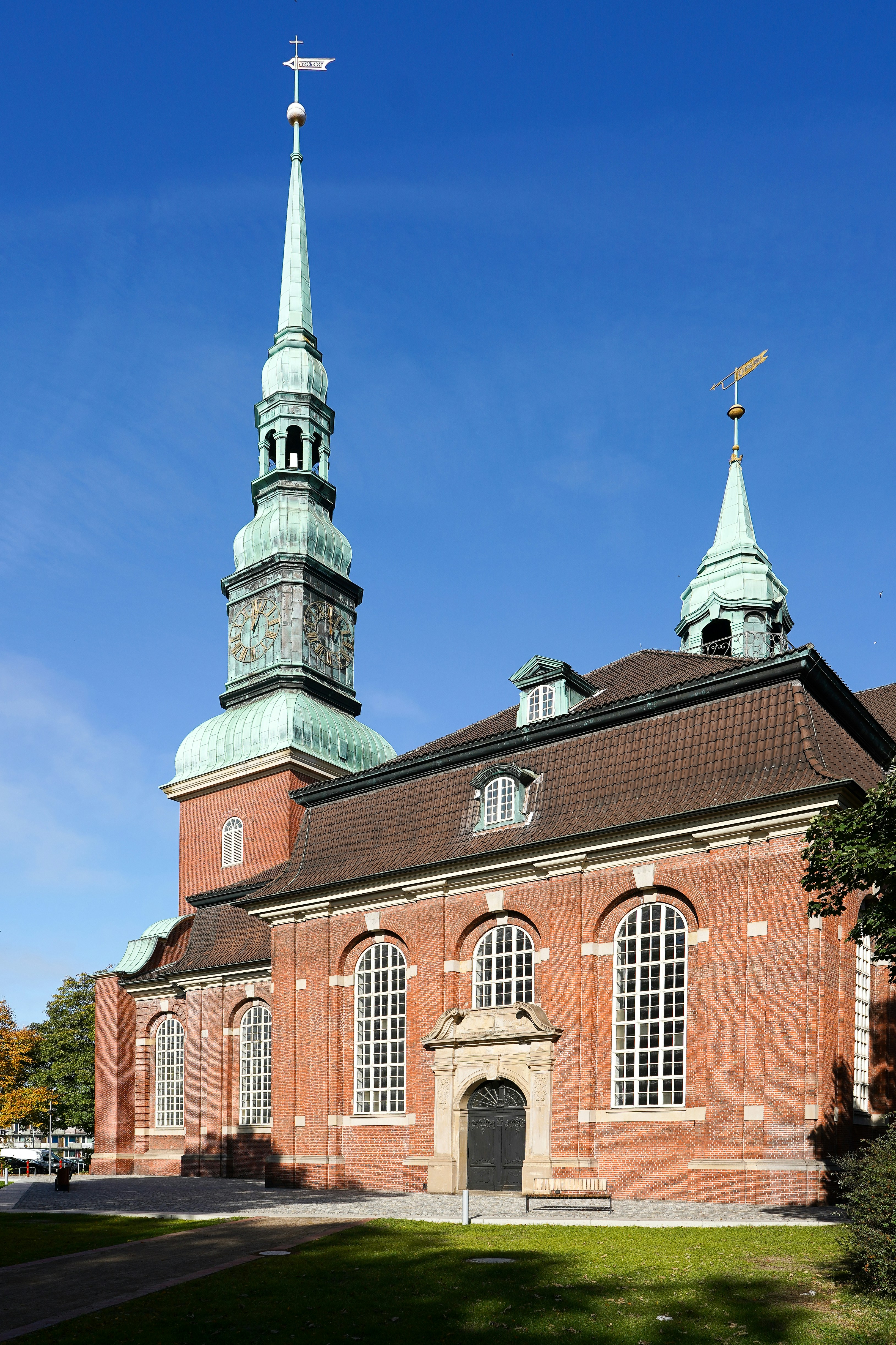 The Brick Choir: Spires and Steel in a Clear Blue Sky
