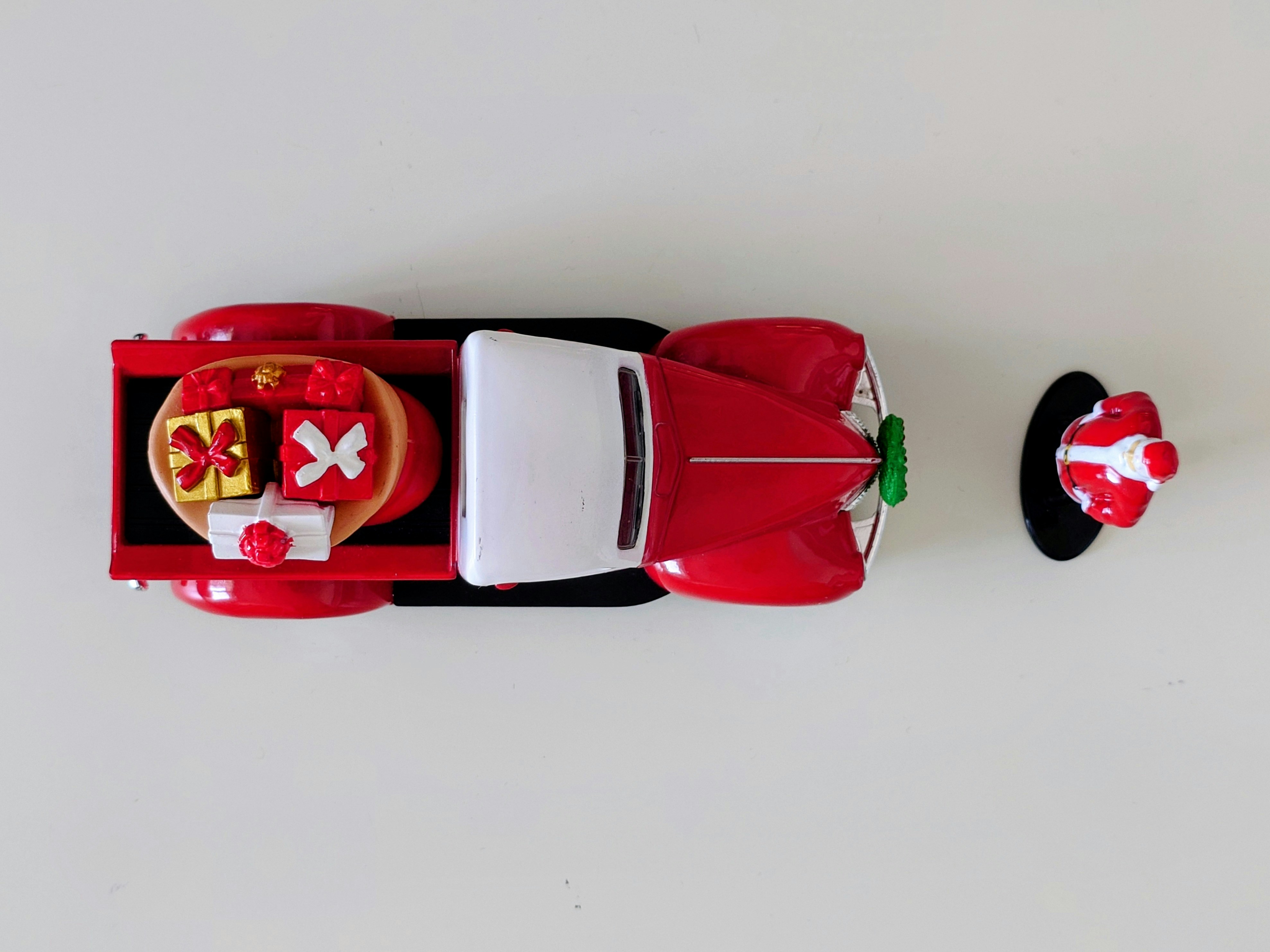 Red vintage truck carrying christmas gifts