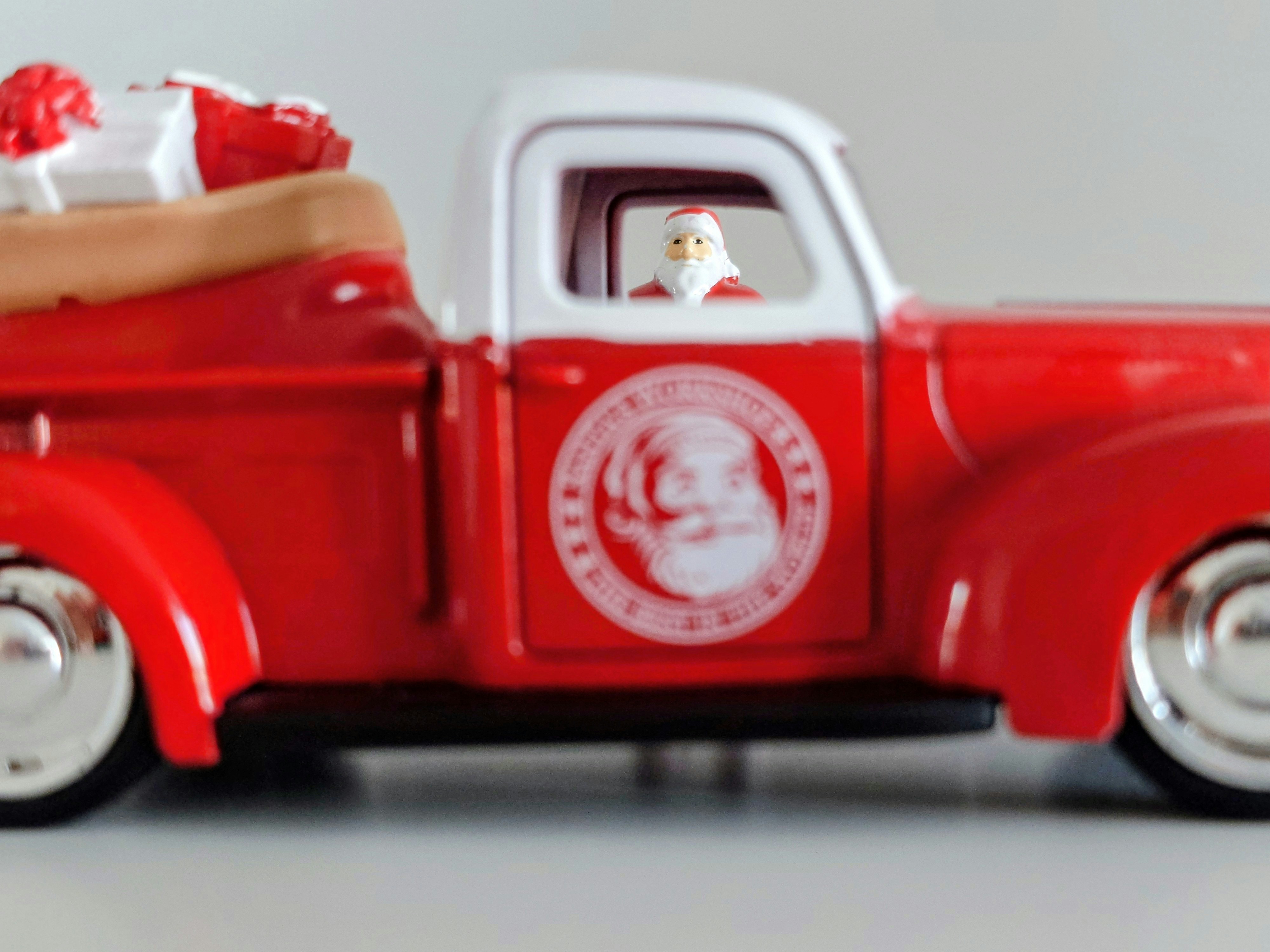 Red vintage truck with santa and gifts