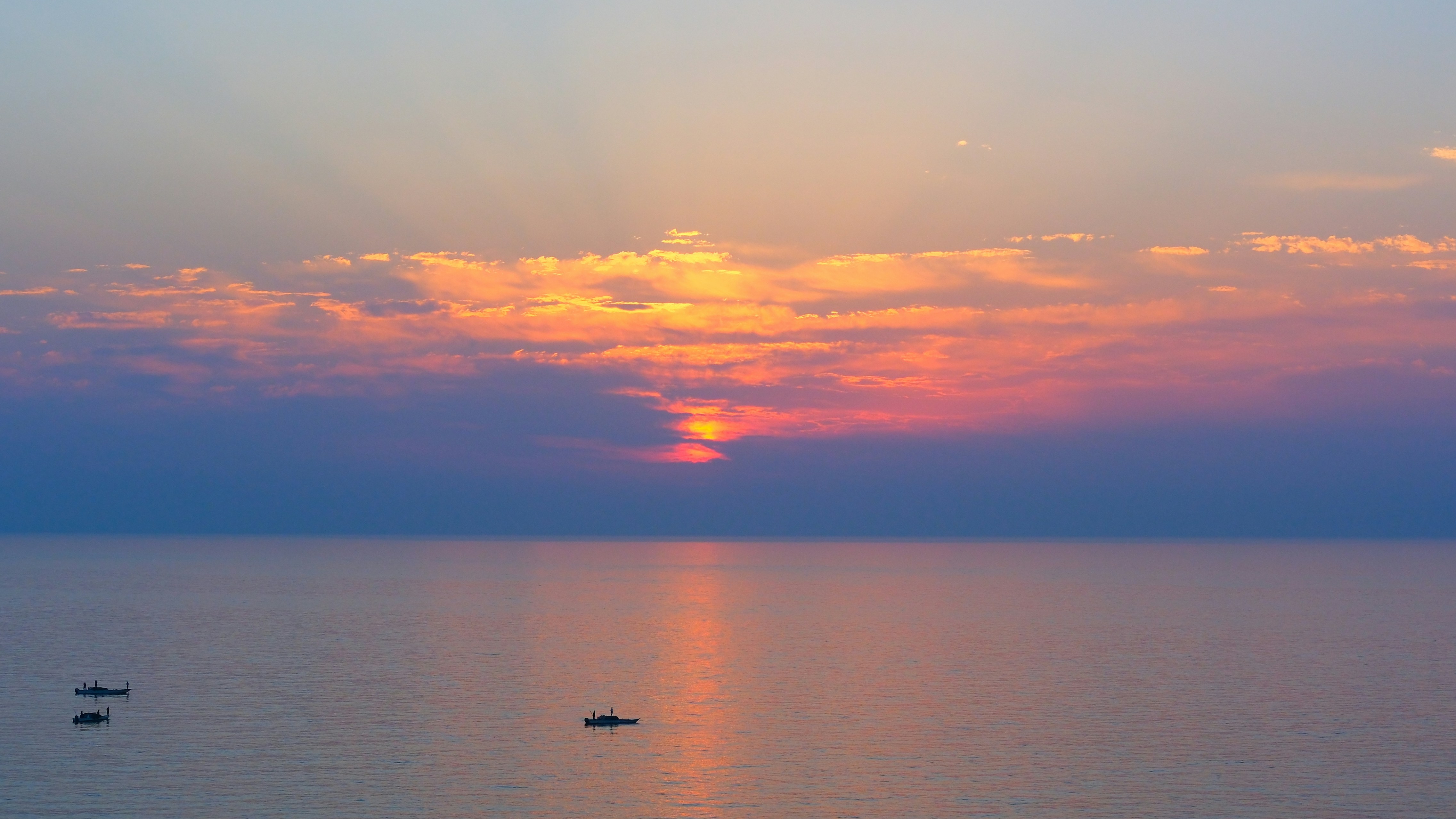 Dawn at the Quiet Gulf: Boats and a Silent Horizon