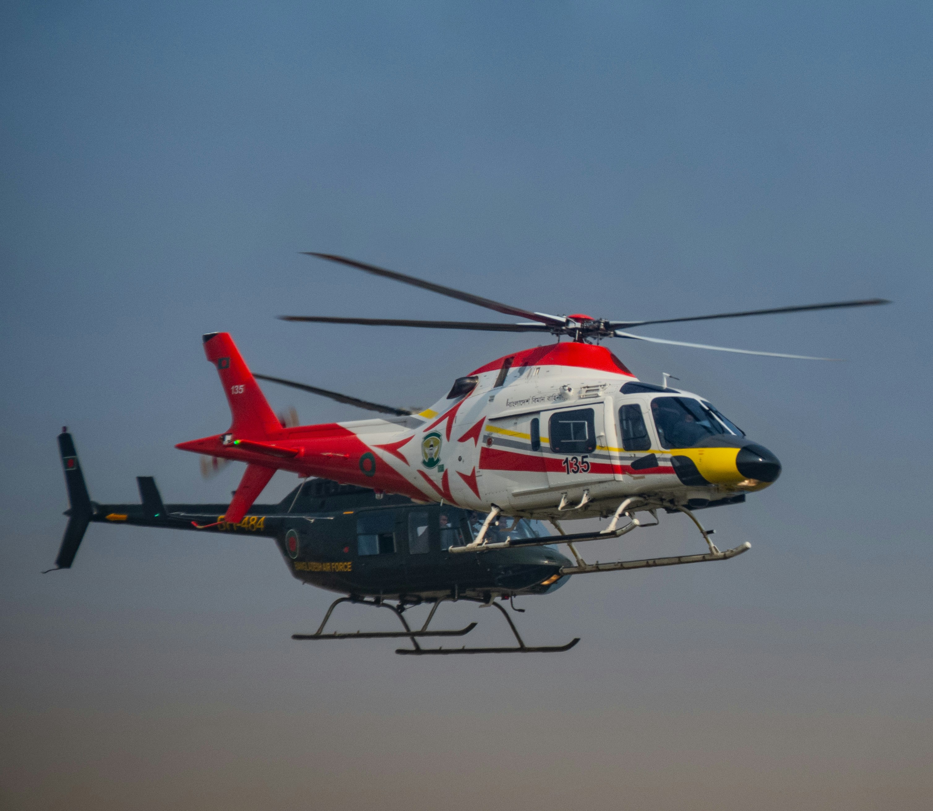 High-Descent Rescue: Red-White Helicopter Breaking the Sky