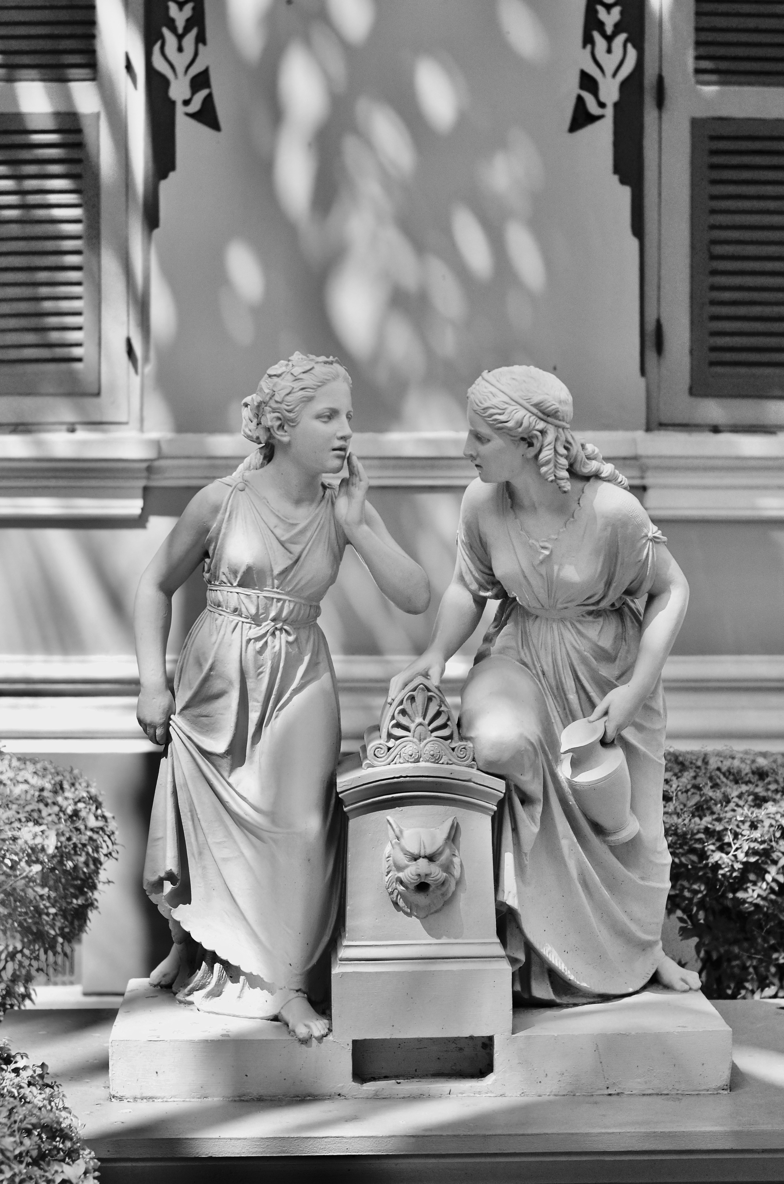 Whispered Secrets Between Marble Statues