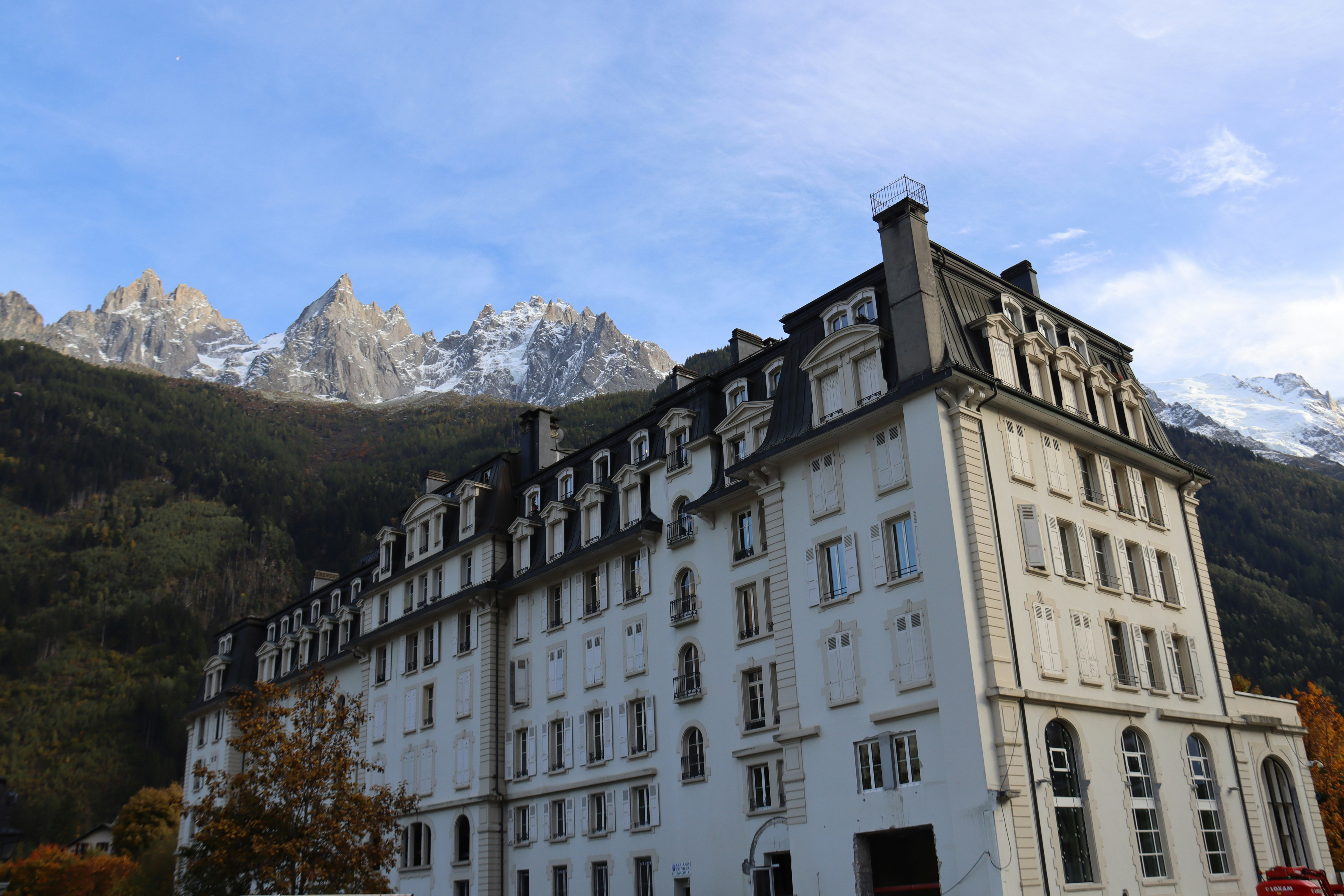 Grand Alpine Hotel Looming Beneath Snow-Capped Peaks