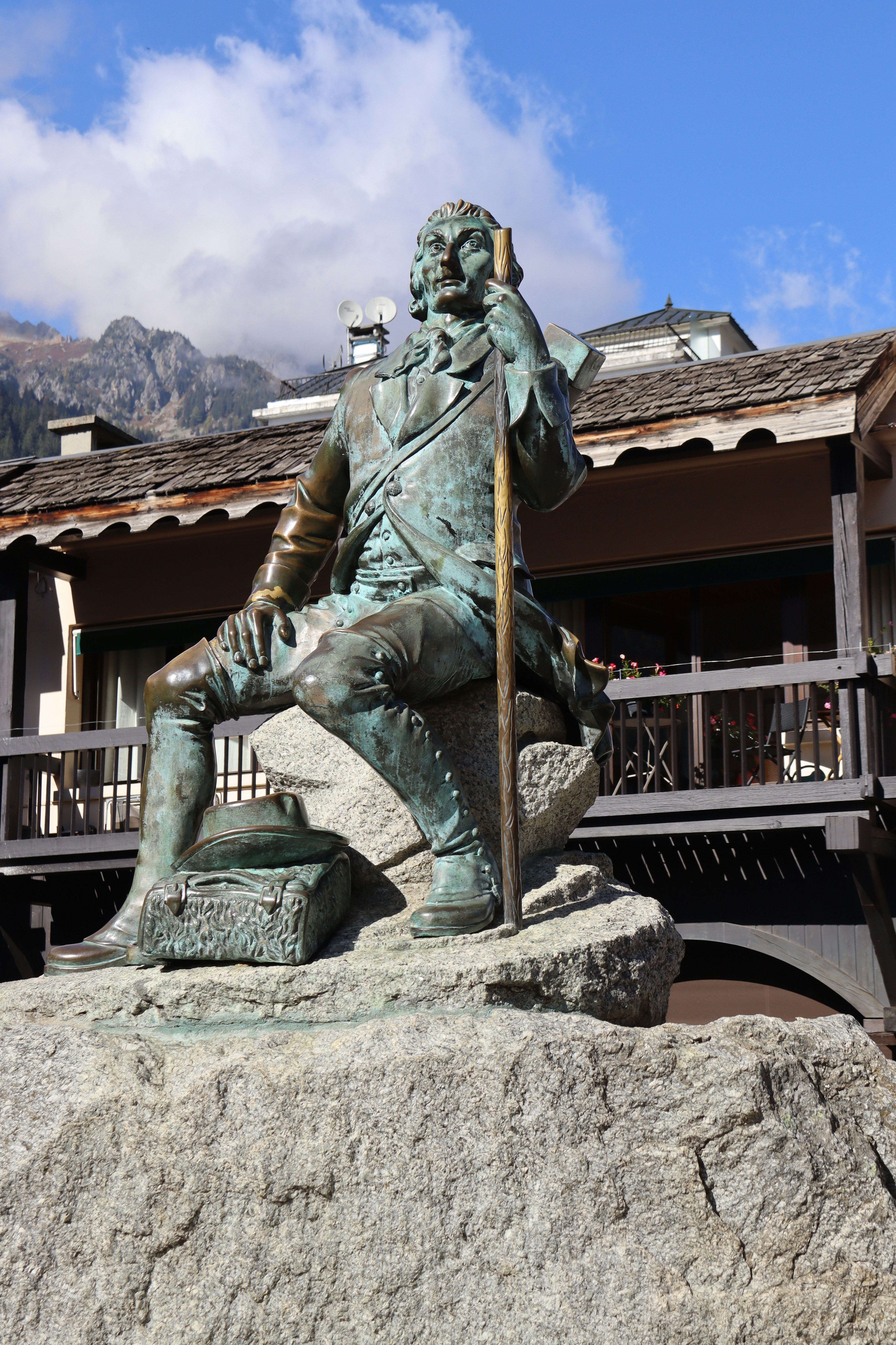 Statue on a Rock: A Moment of Contemplation in Alpine Village