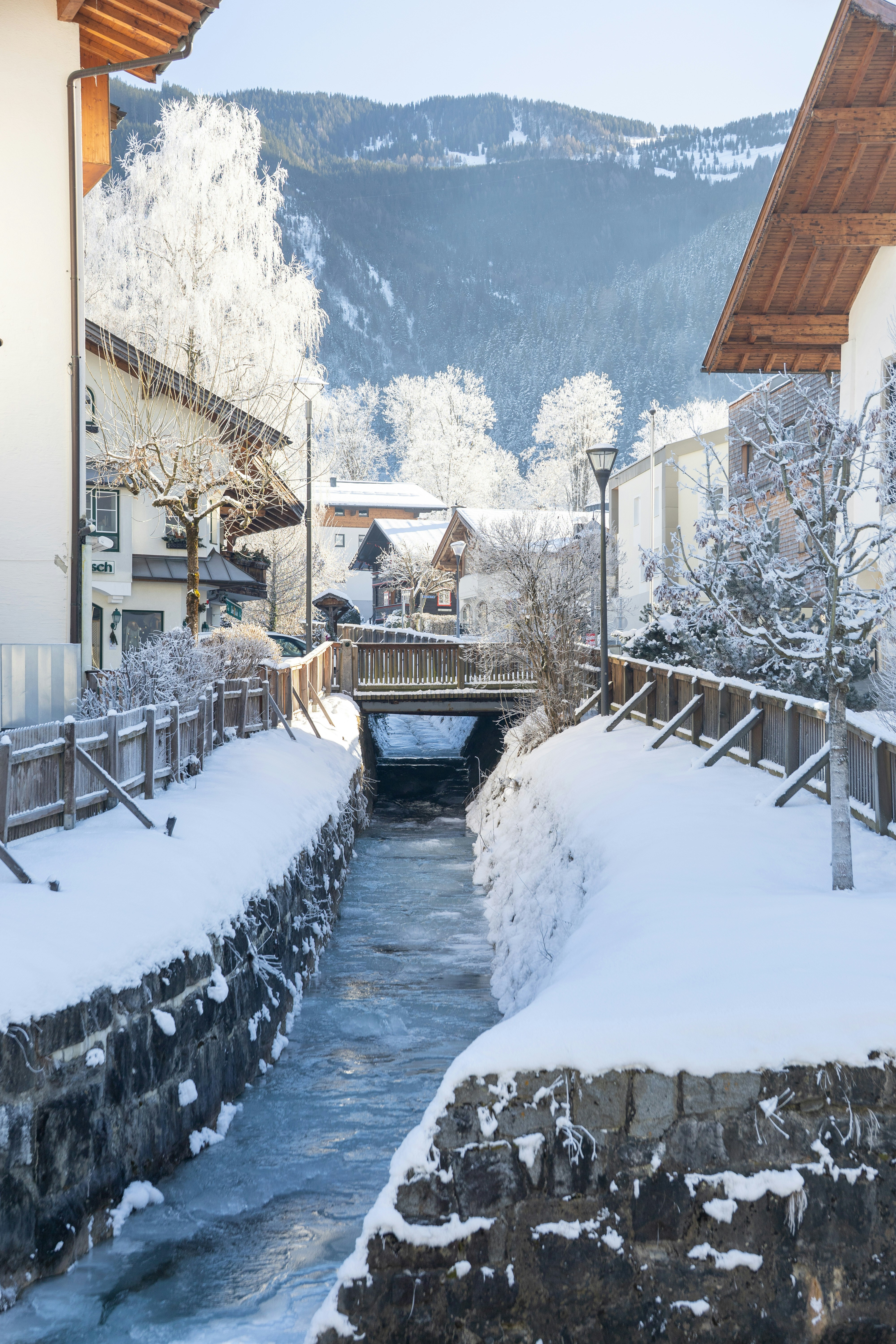 Snowbound Creek Through a Swiss Village