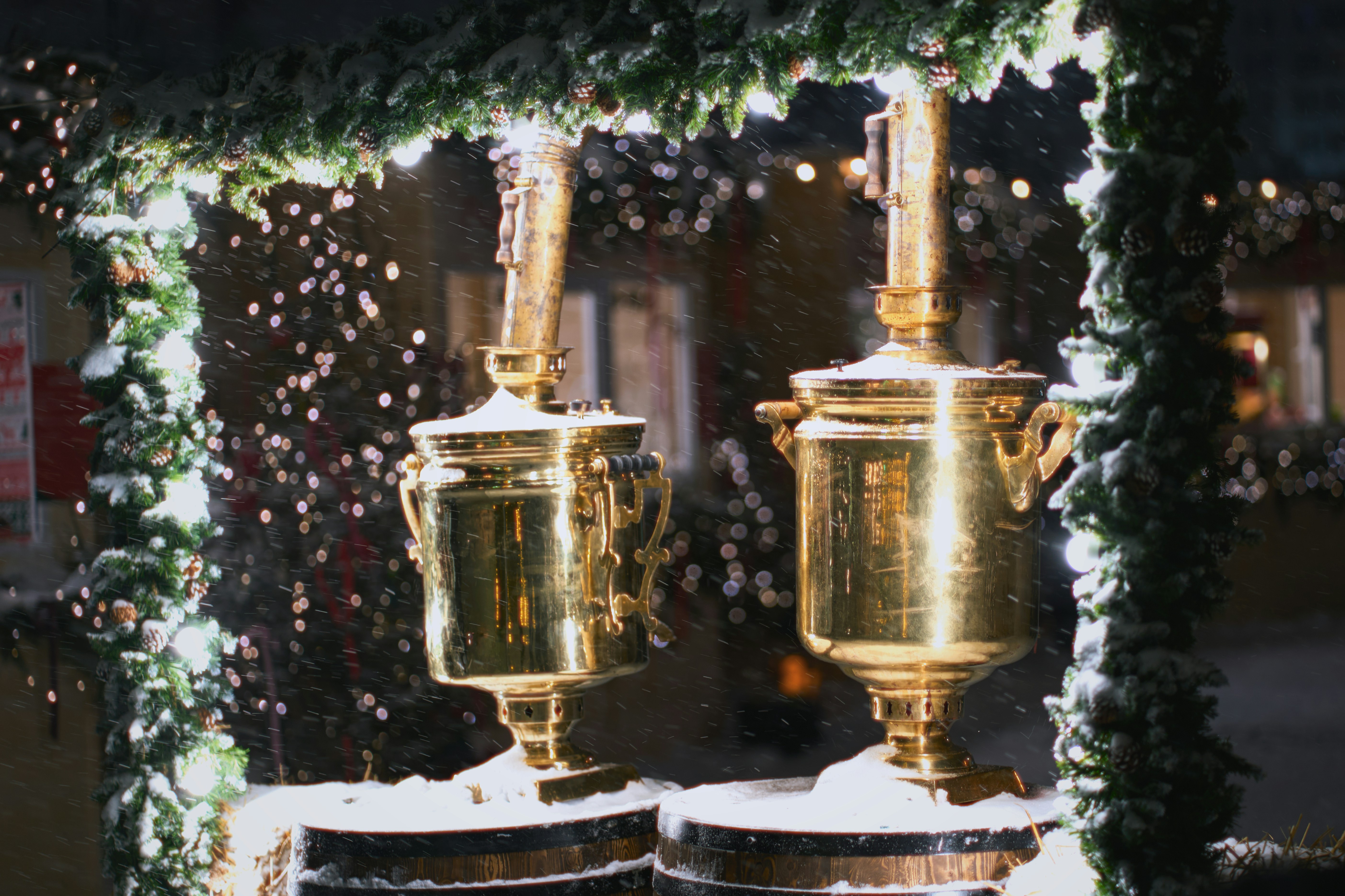 Gilded Urns Under Holiday Garland