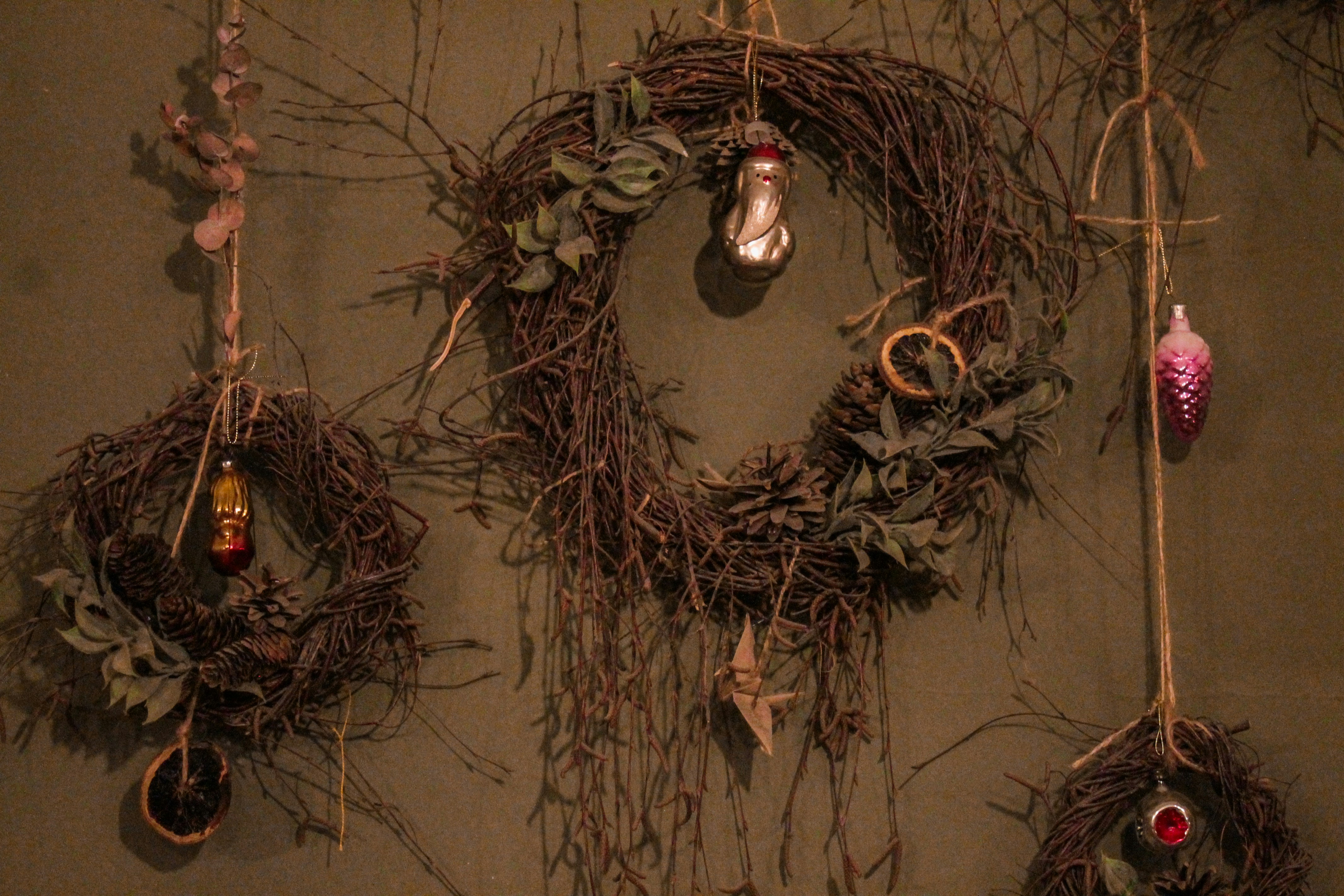 Wreaths and Ornaments in Dim Wall Space