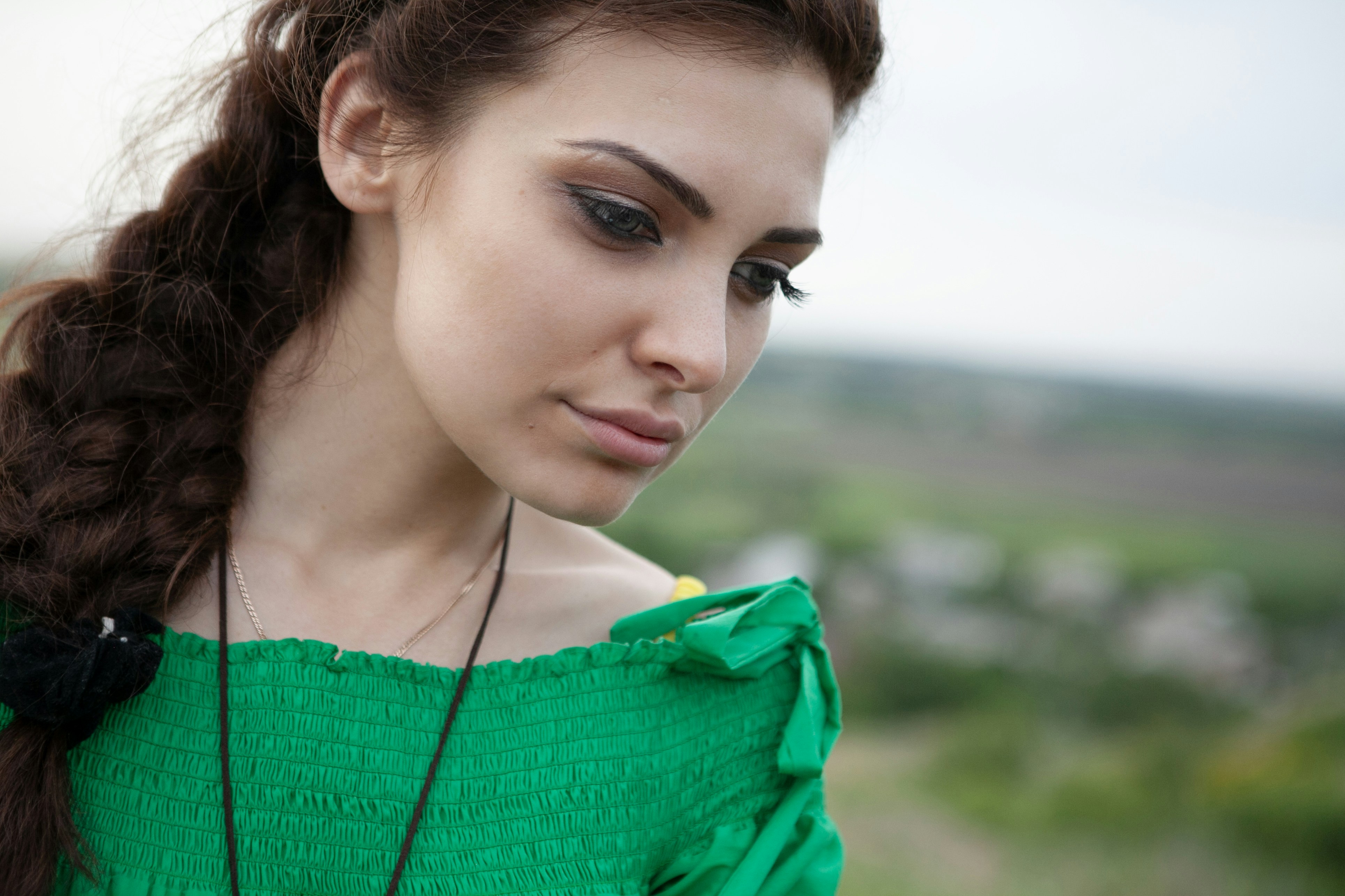 Portrait in Green: Subtle Gaze Over a Quiet Landscape
