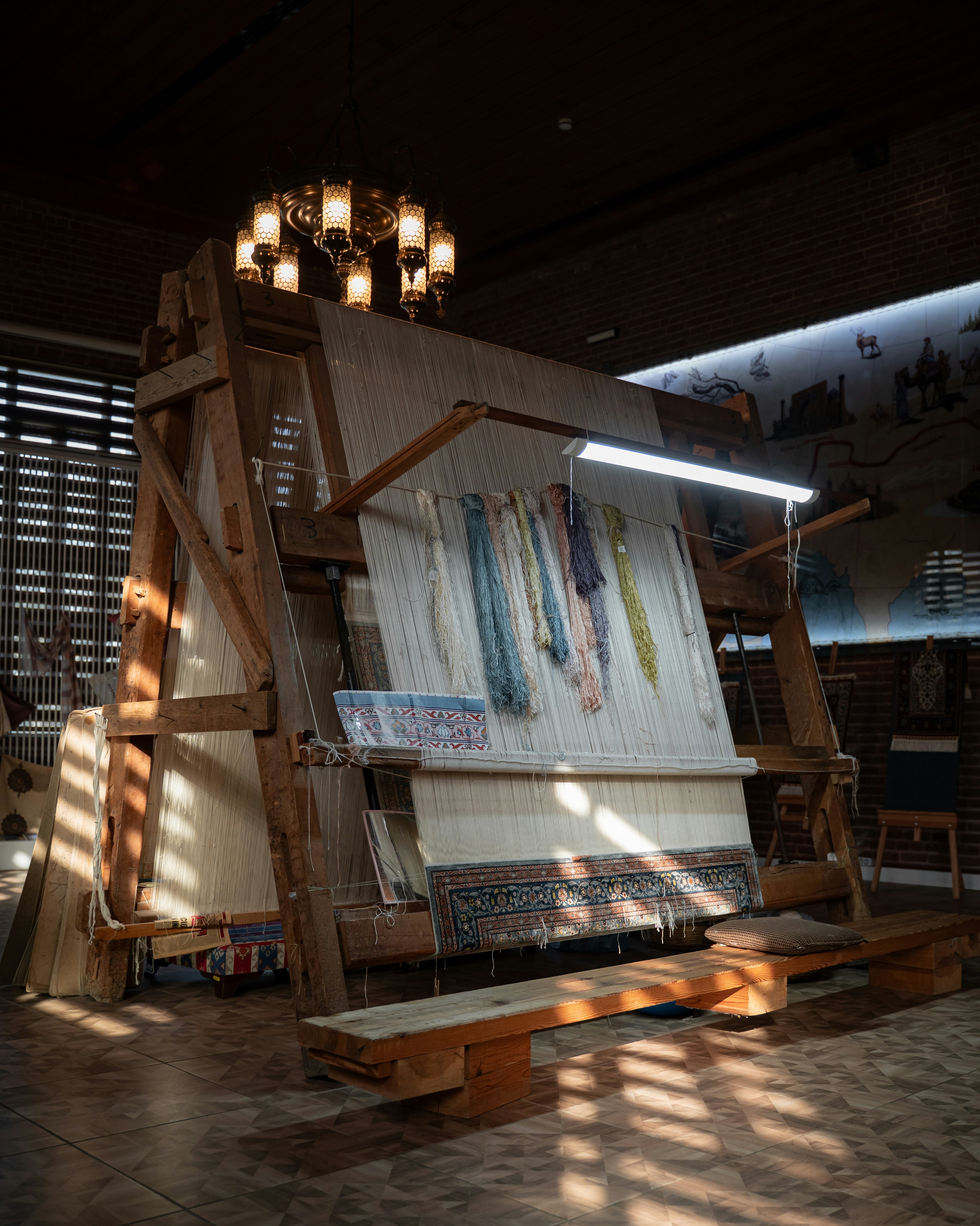 Weaving Light: A Traditional Loom Studio Amid Striped Threads