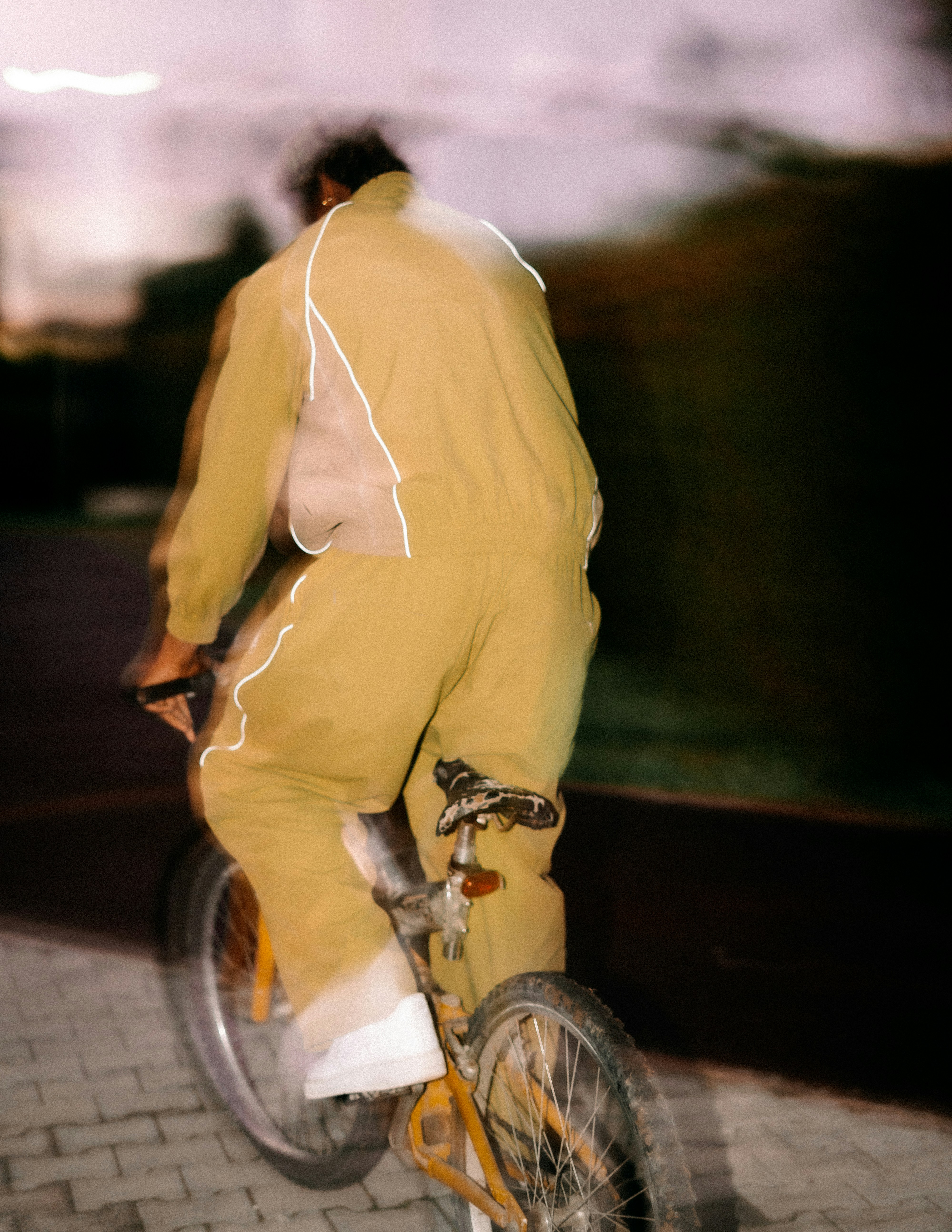 Night Ride: A Blur of Motion on a Yellow Bike