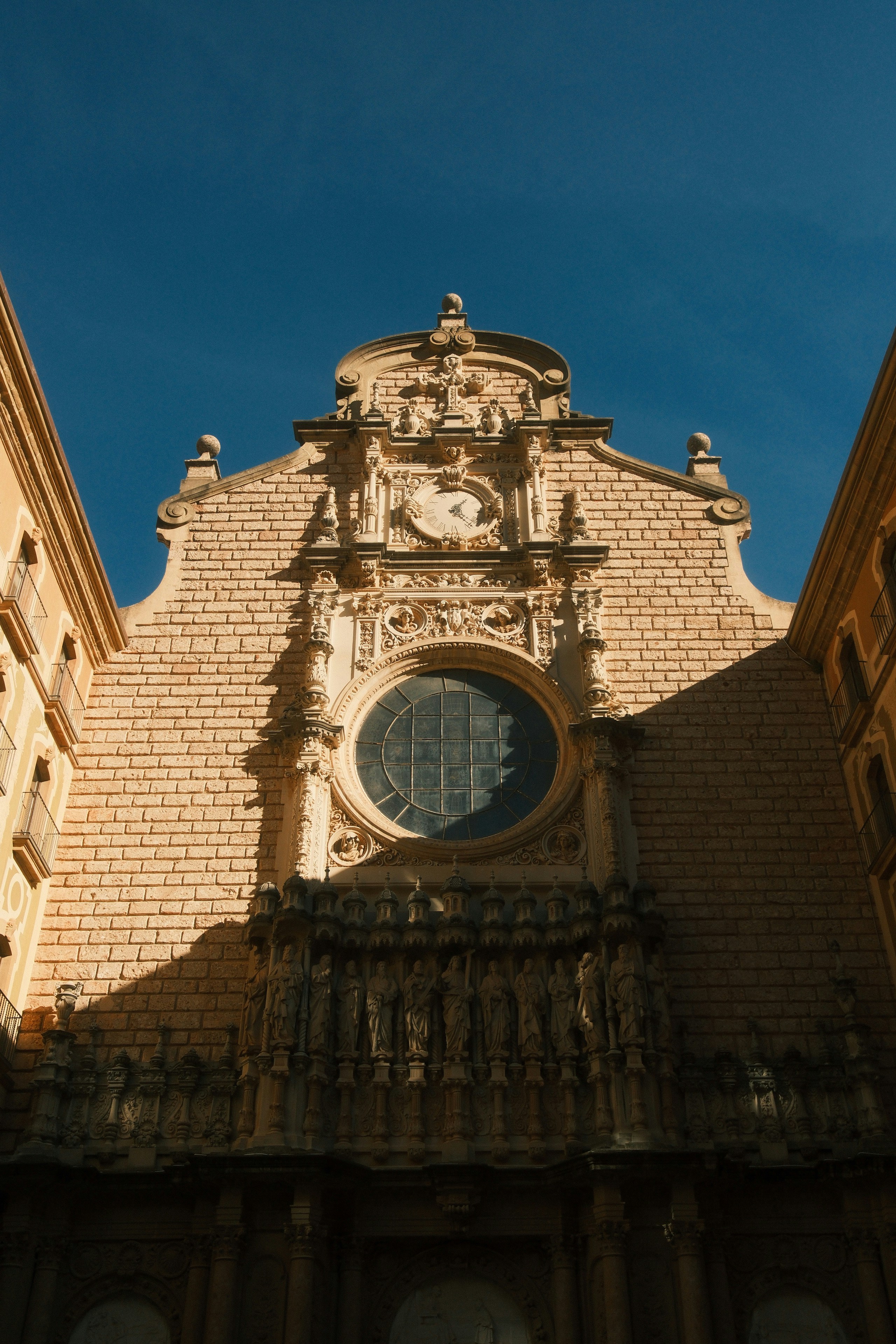 Stone Facade in Warm Light: A Baroque Gable Reaching Toward the Sky