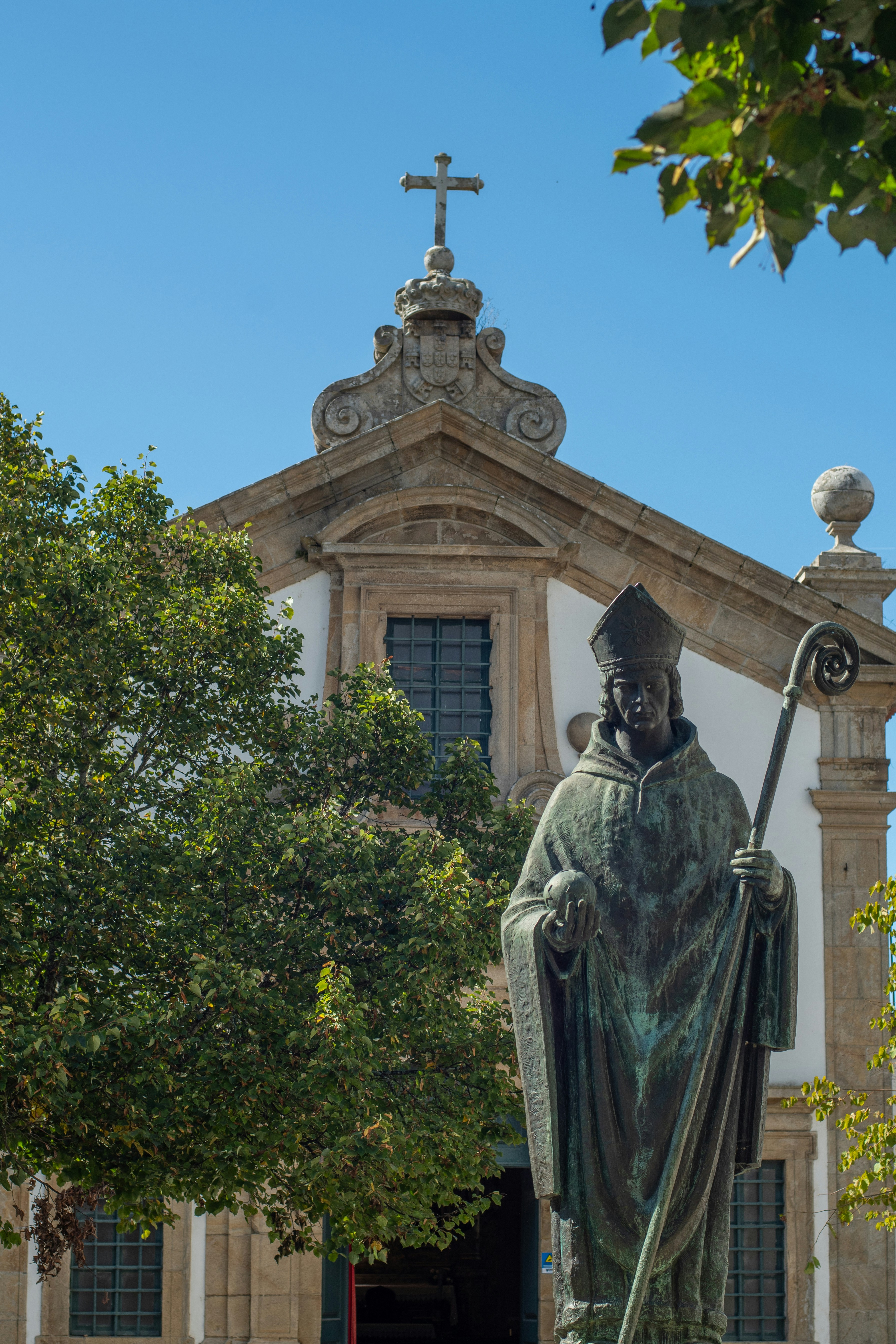 Statue Guardian Before a Baroque Chapel