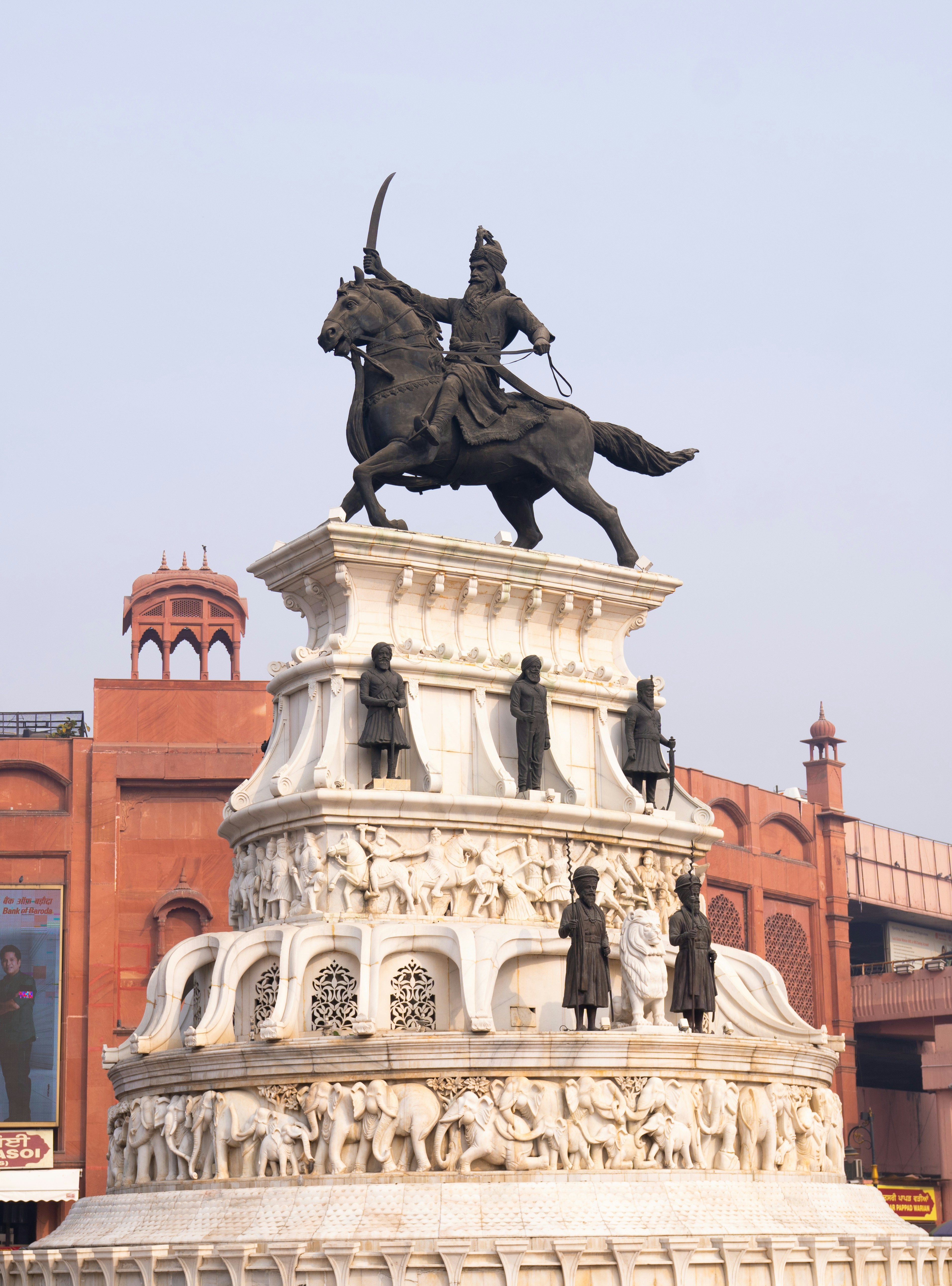 Galloping Hero: Equestrian Monument Rising from carved pedestal