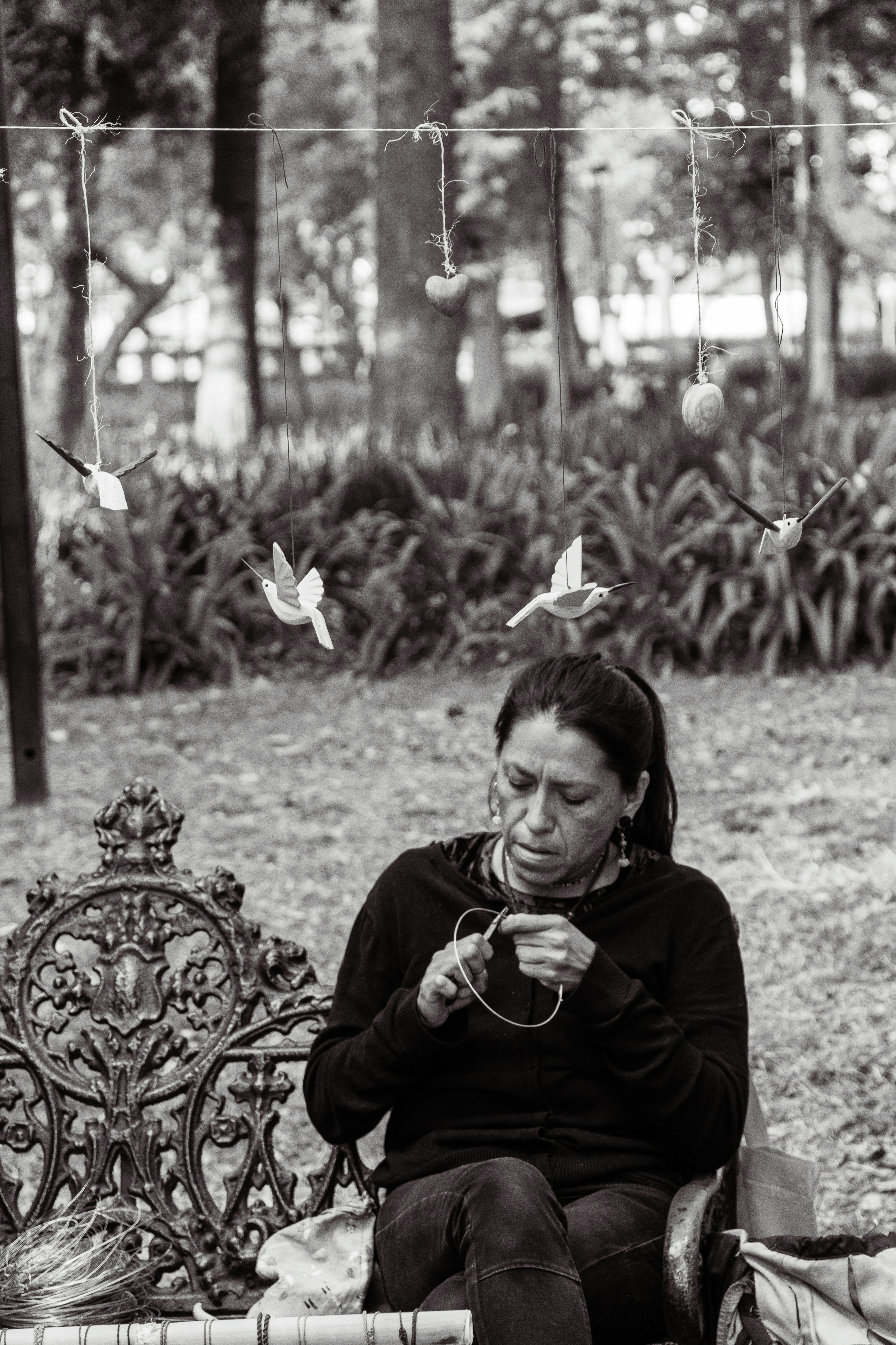 Threaded Moments: A Moment of Quiet Craft on a Park Bench