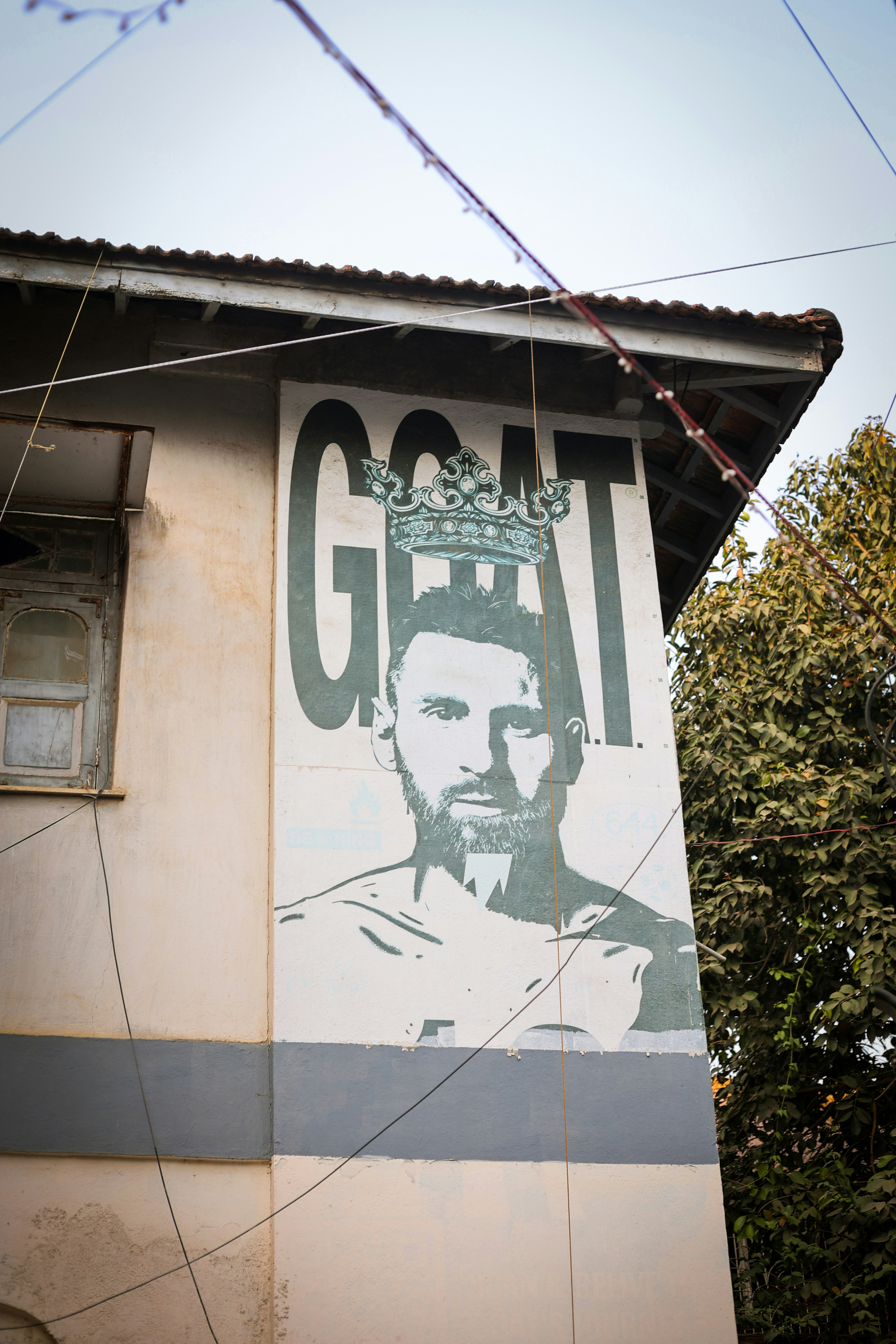 Crowned Portrait on a Crumbling Facade