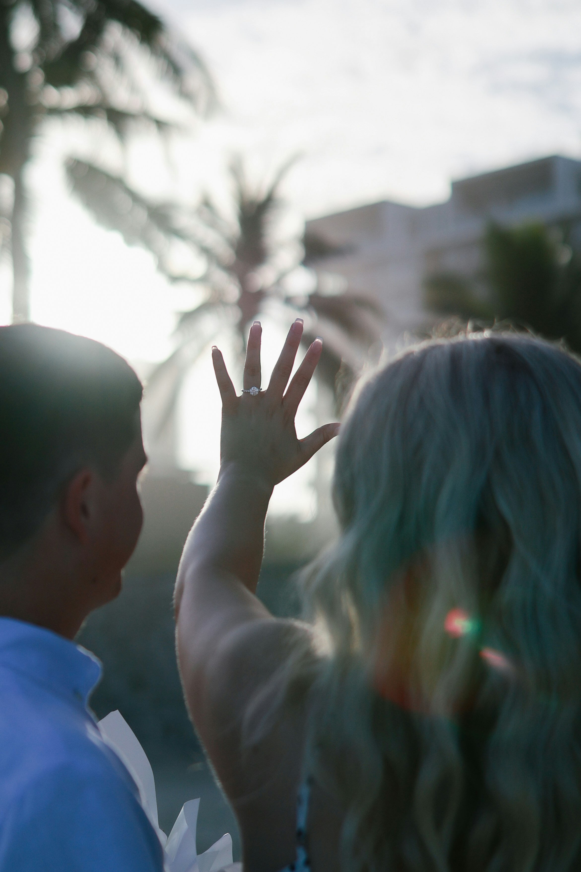 Raised Hand Adornment Amid Backlit Moment