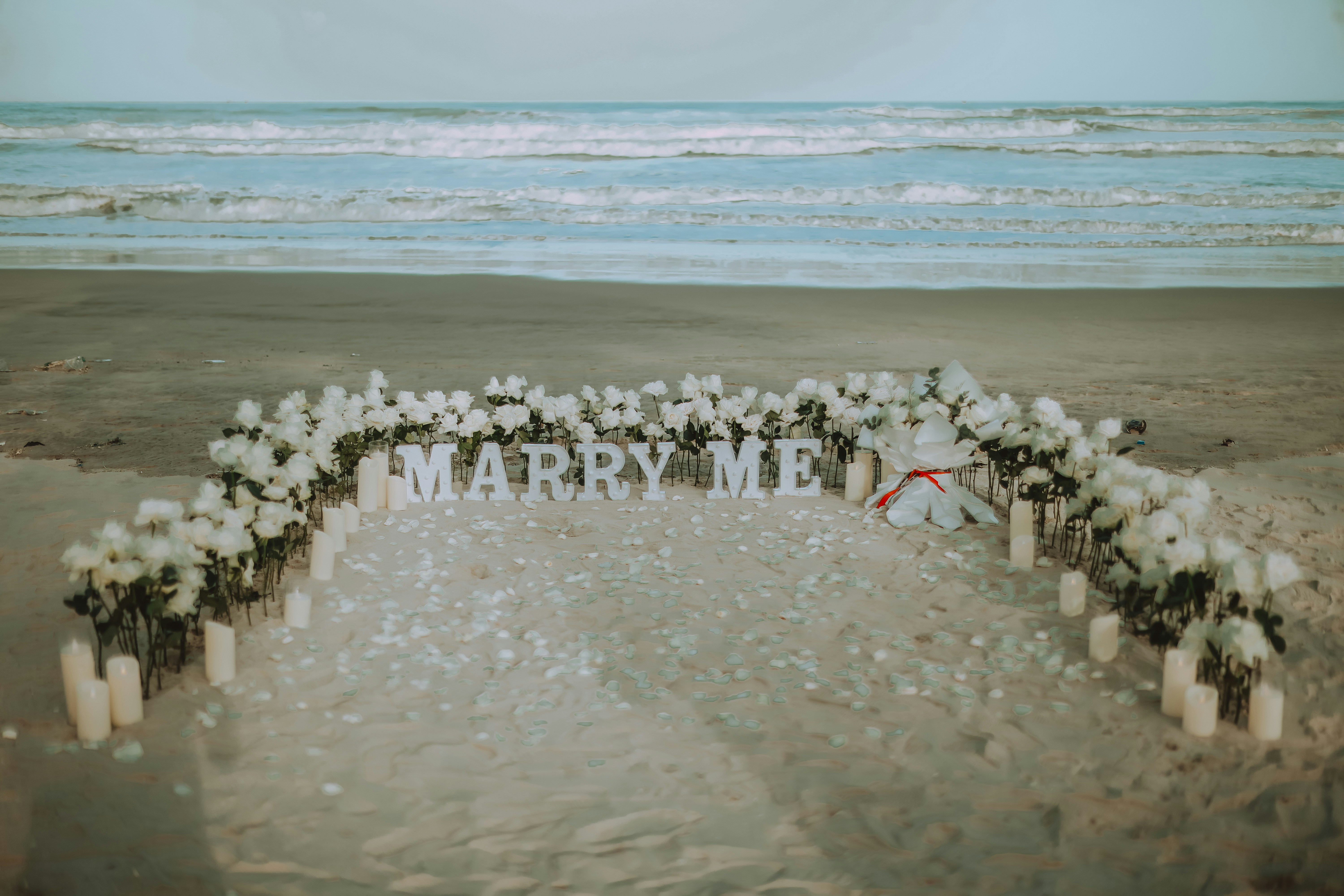 Whispered I Do on a Sandy Altar Between Flowers