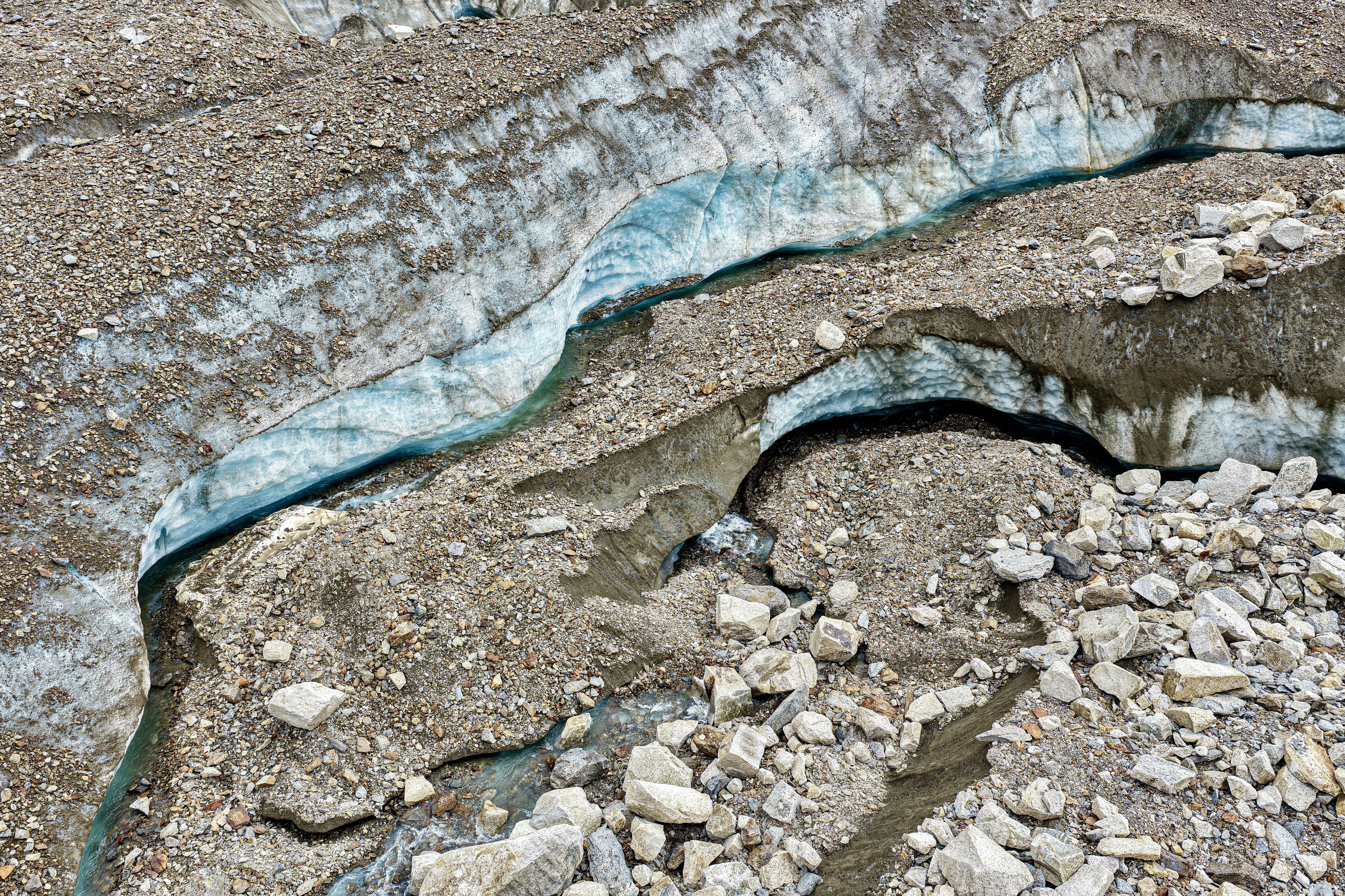 Glacial Melt Trail: A Weathered Sediment Fold in Crushed Rock