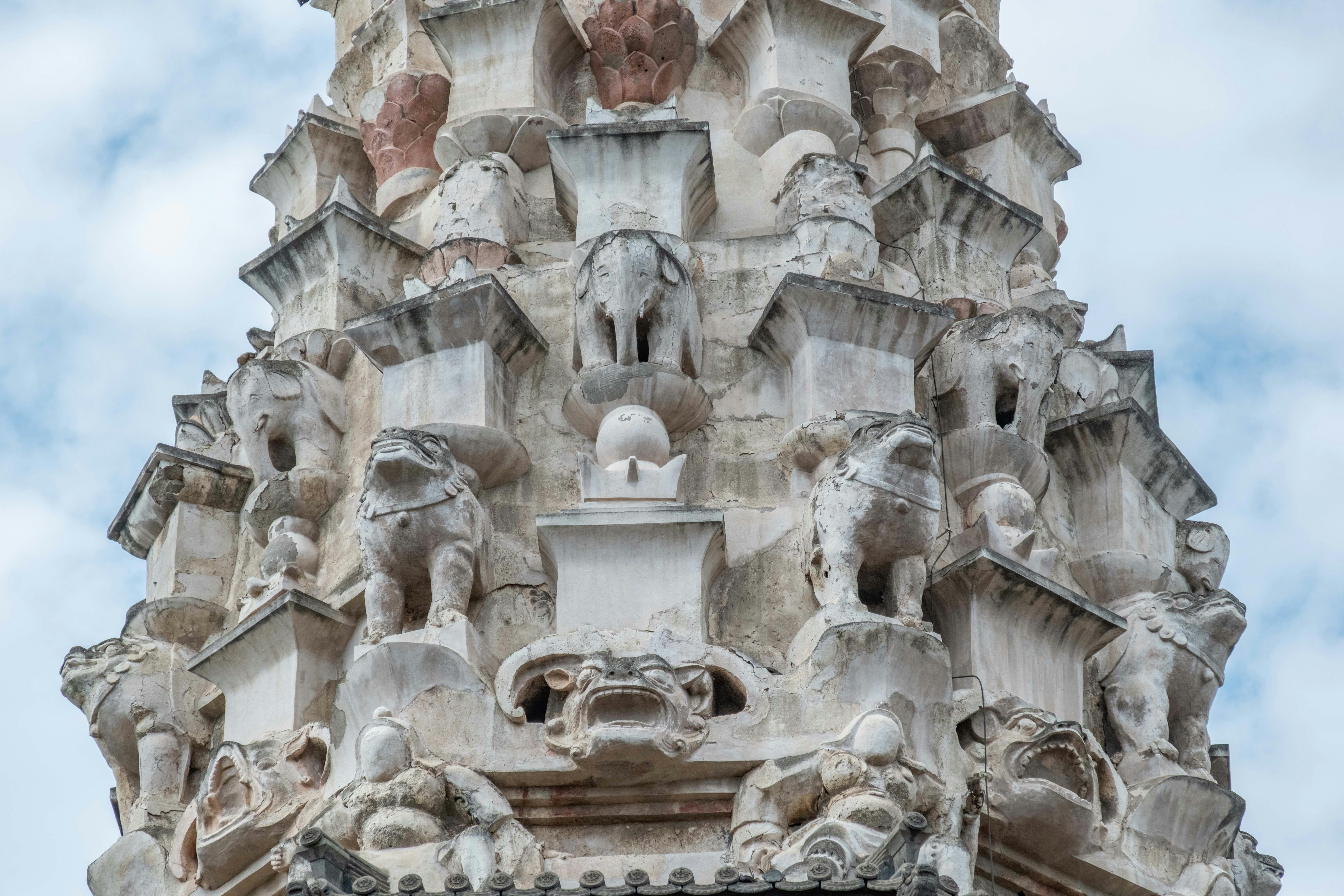 Carved Guardians Rising: A Narrrative of Stone Faces Climbing Toward the Sky