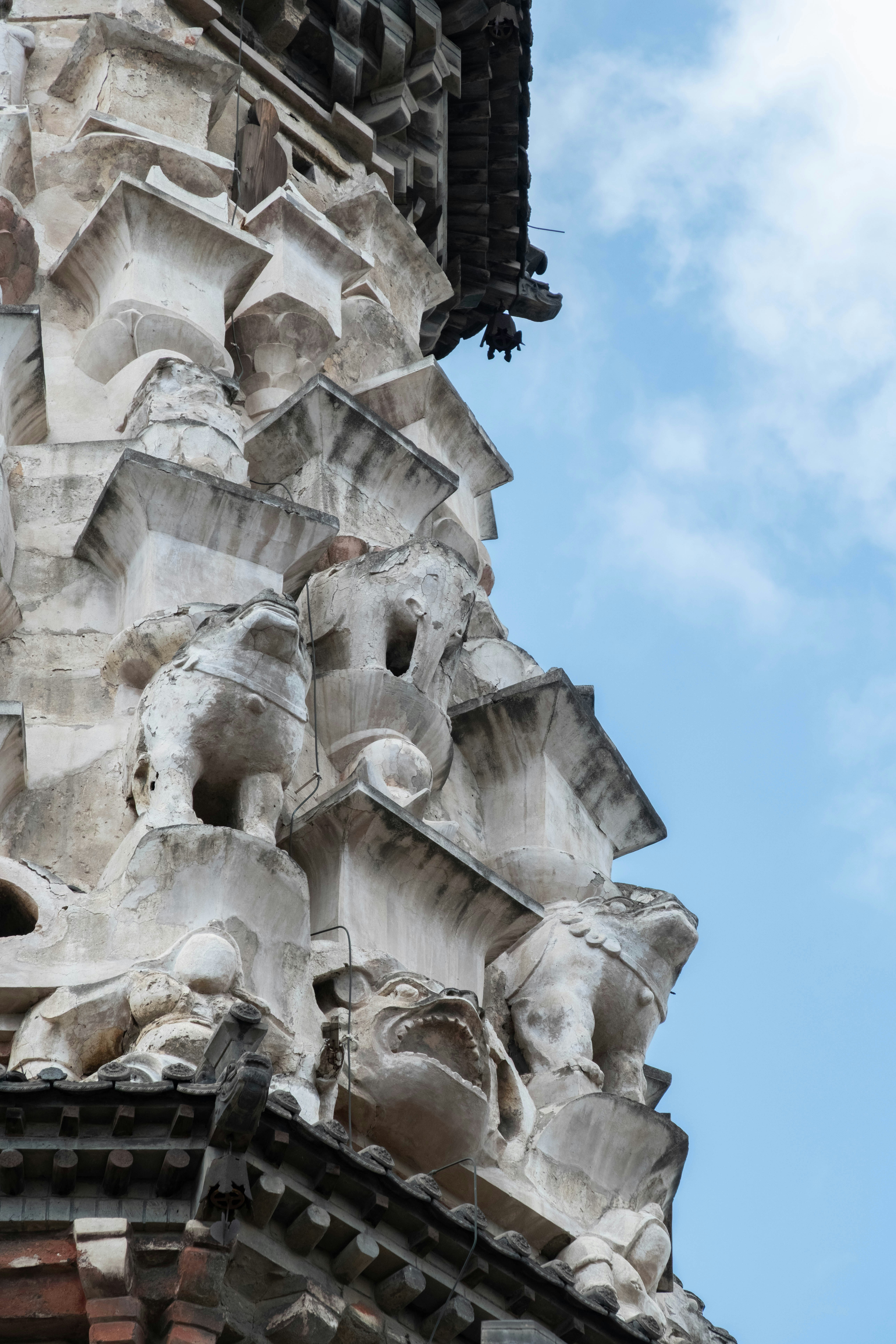 Stone Carved Tower Edge Against a Clear Sky