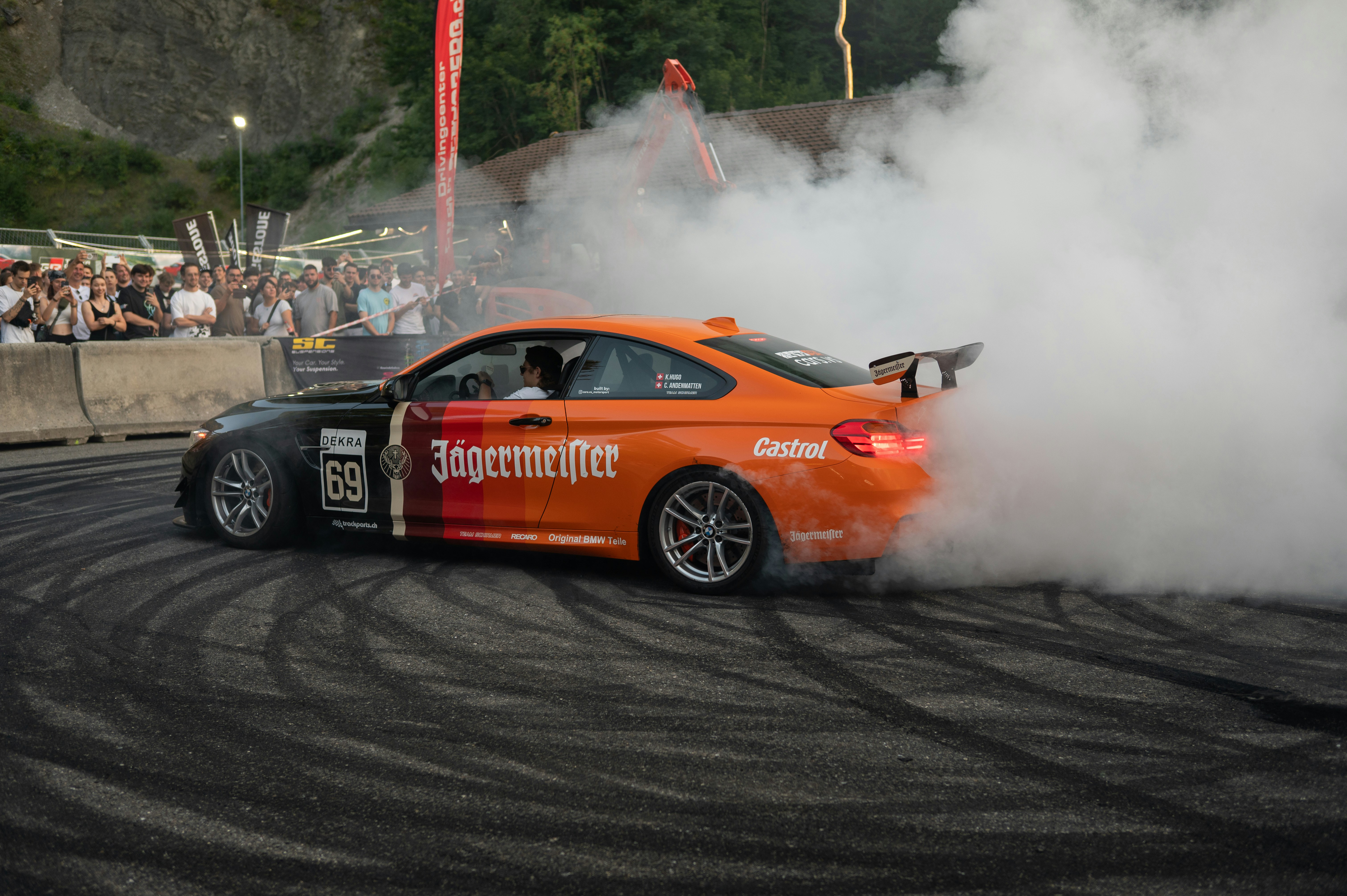 Flaming Orange Drifter: Jägermeister Racing Car Powers Through Smoke