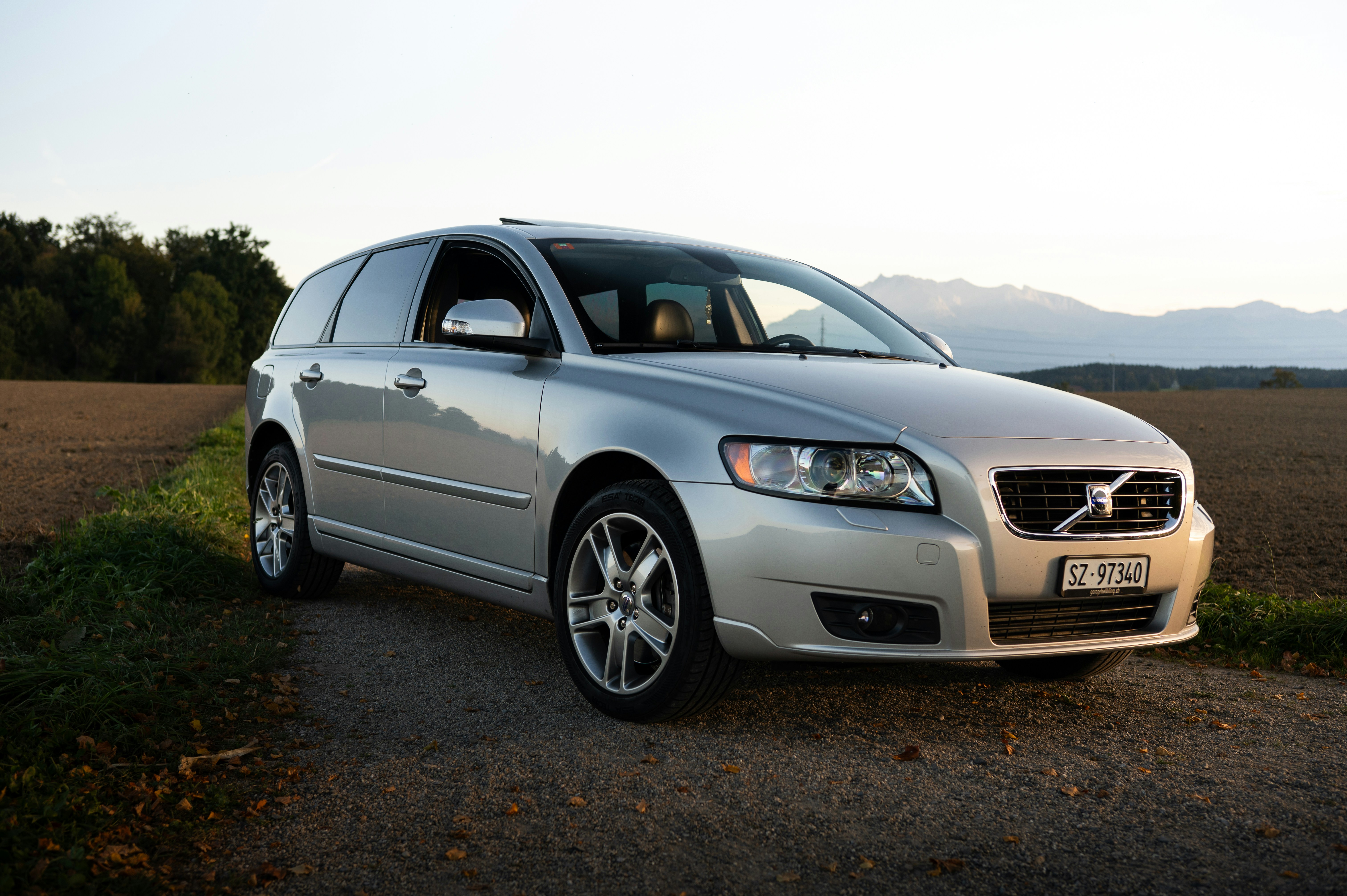 Silver Volvo Station Wagon Resting on a Rural Gravel Road