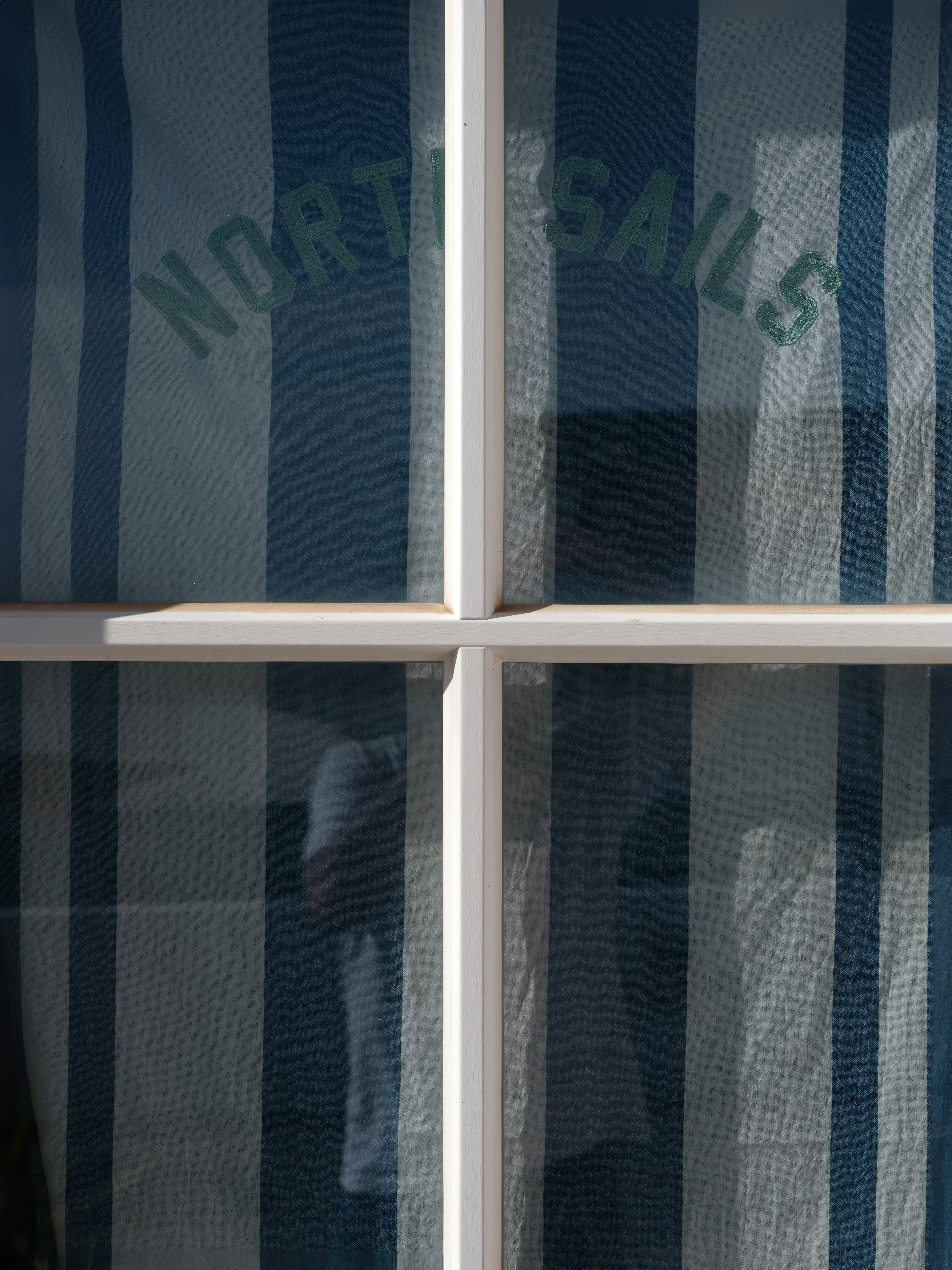 Vertical Stripes and Window Cross: A Quiet Facade of North Sails
