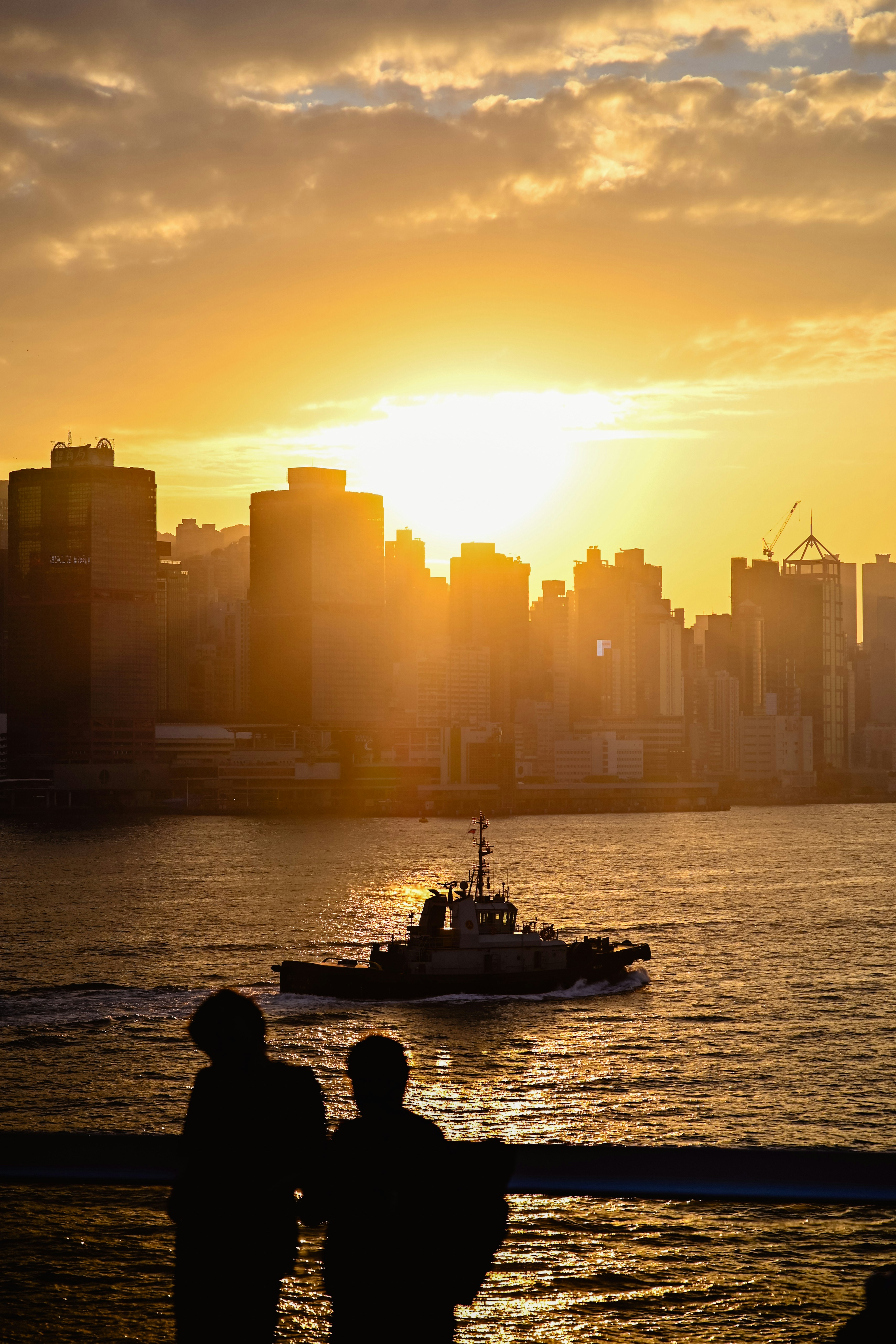 Golden Harbor: Sunset Silhouette over the City