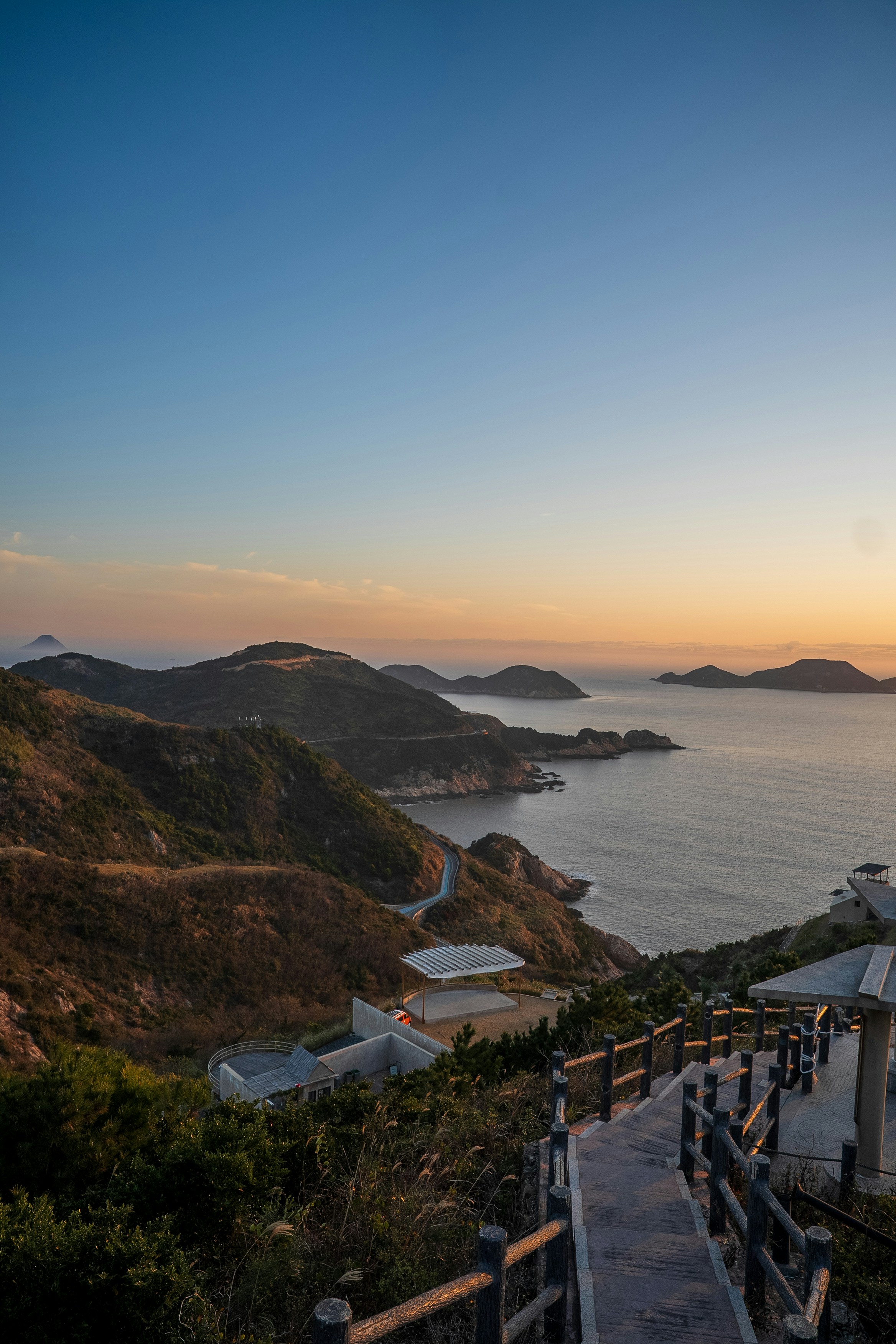 Sunset Over Coastline Path: A Serene Ascent Along the Cliffside Walk