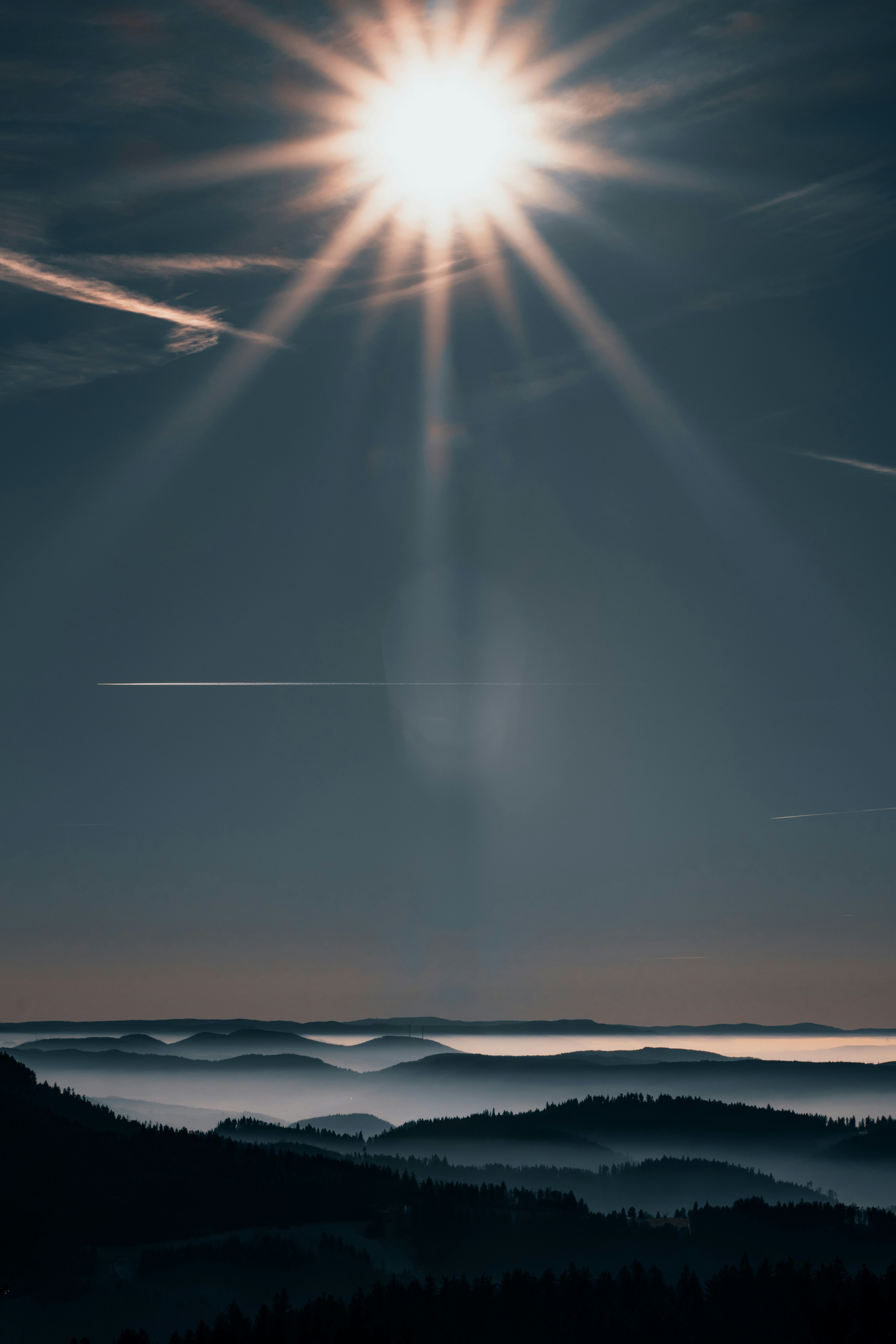 Sunburst Over Misty Valleys