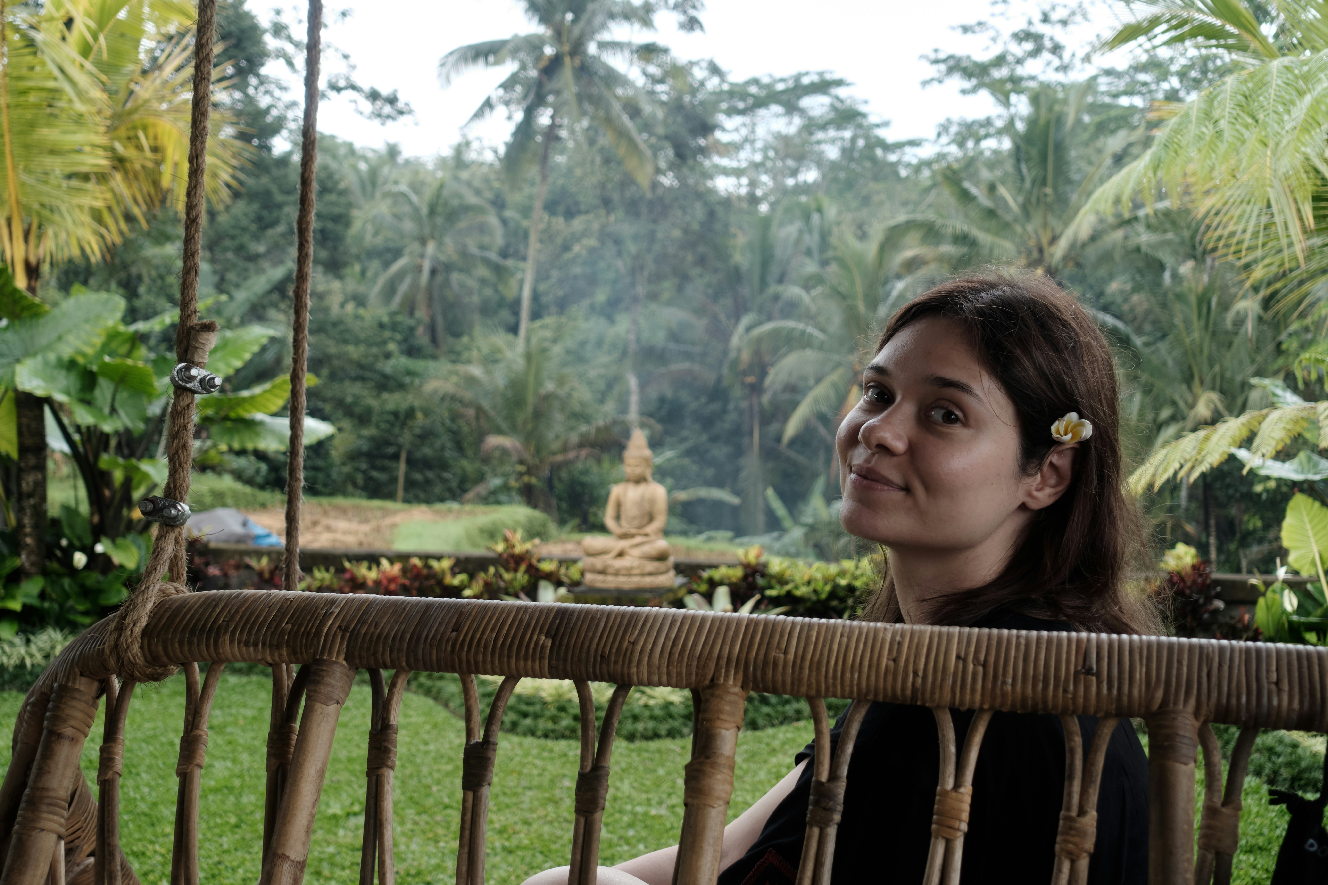 Forest Garden Portrait: A Quiet Smile Behind the Bamboo Rail
