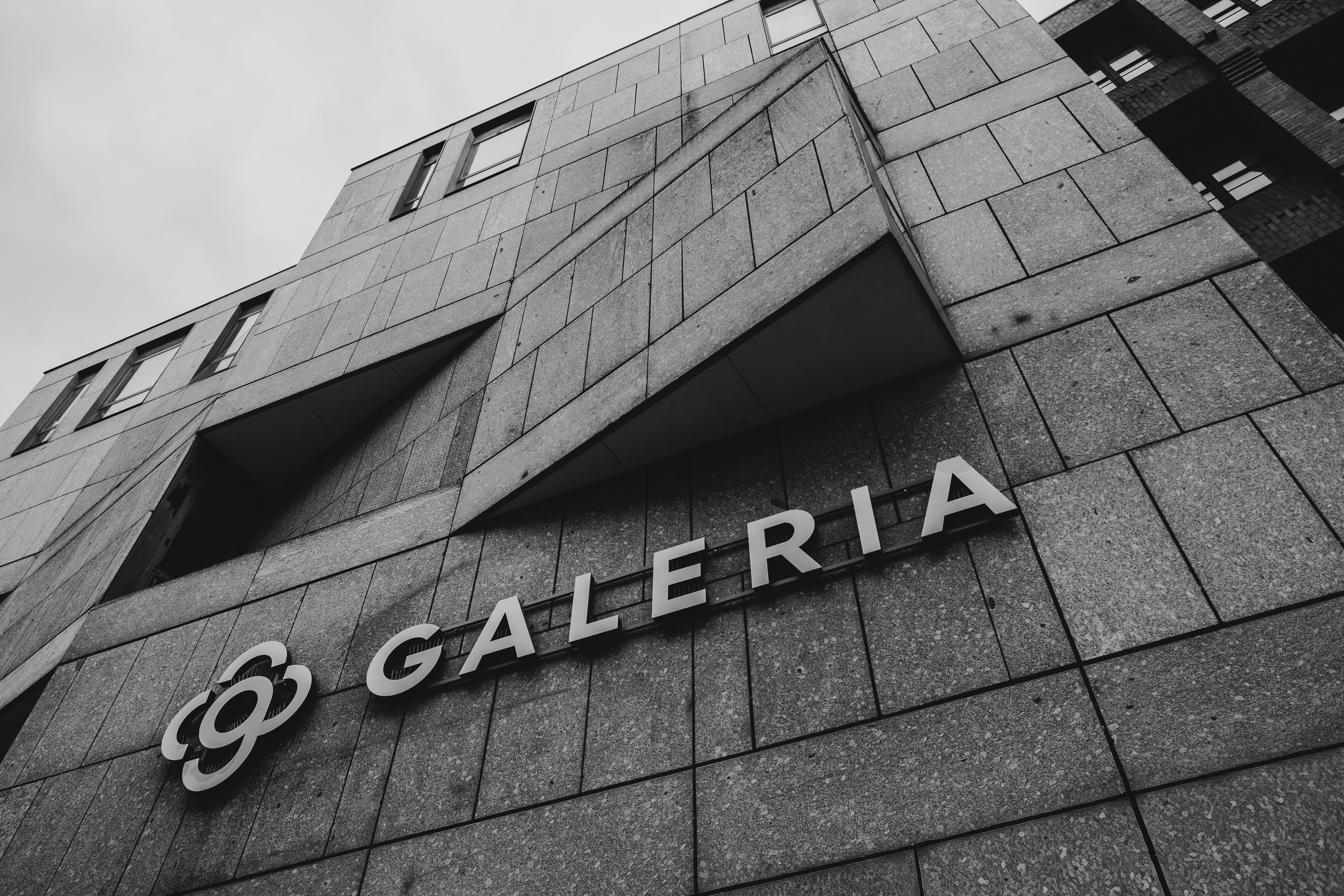 Angular Facade: Galeria Tiles Converge at Tilted Perspective