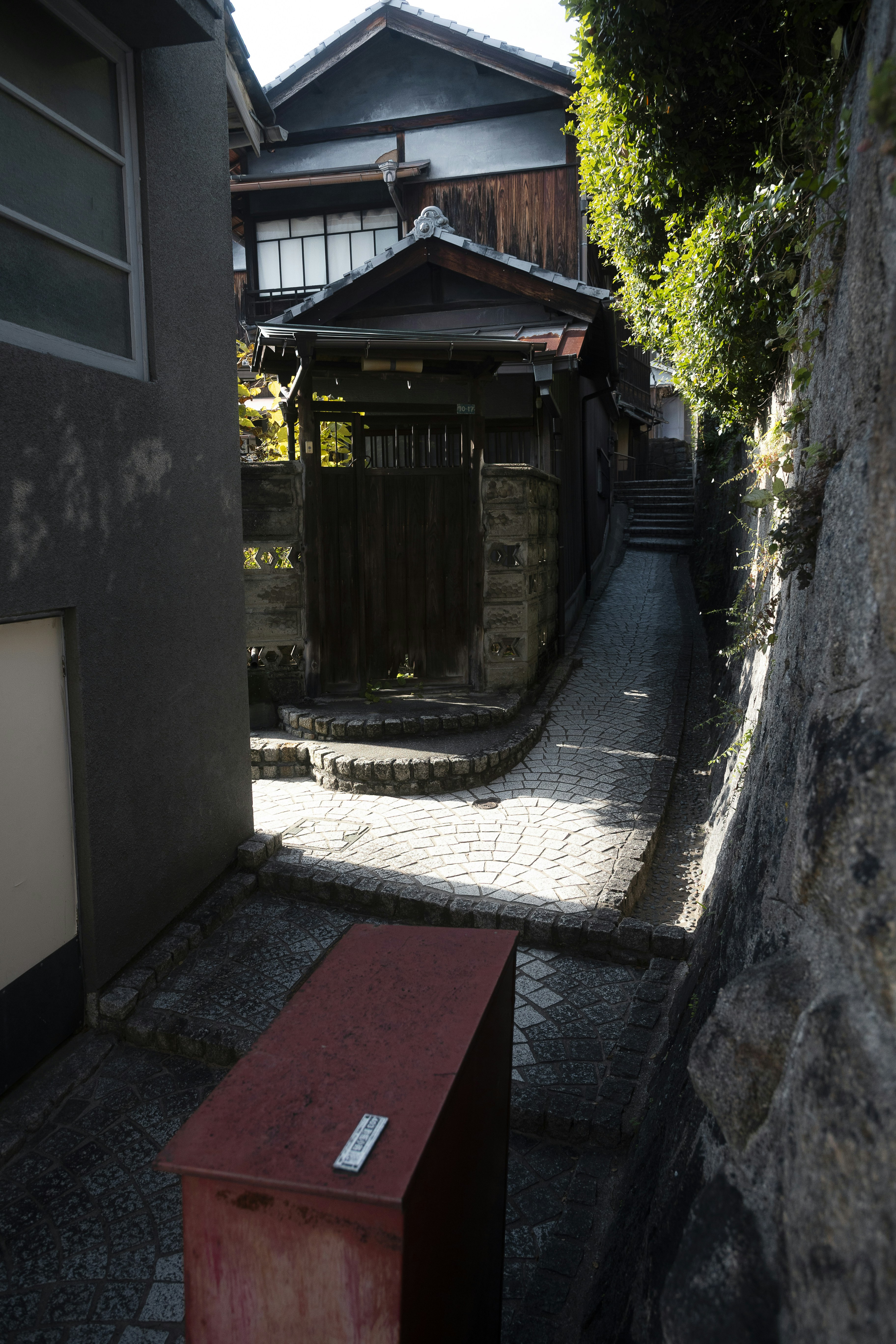 Narrow Staircase to a Shaded Temple Gate