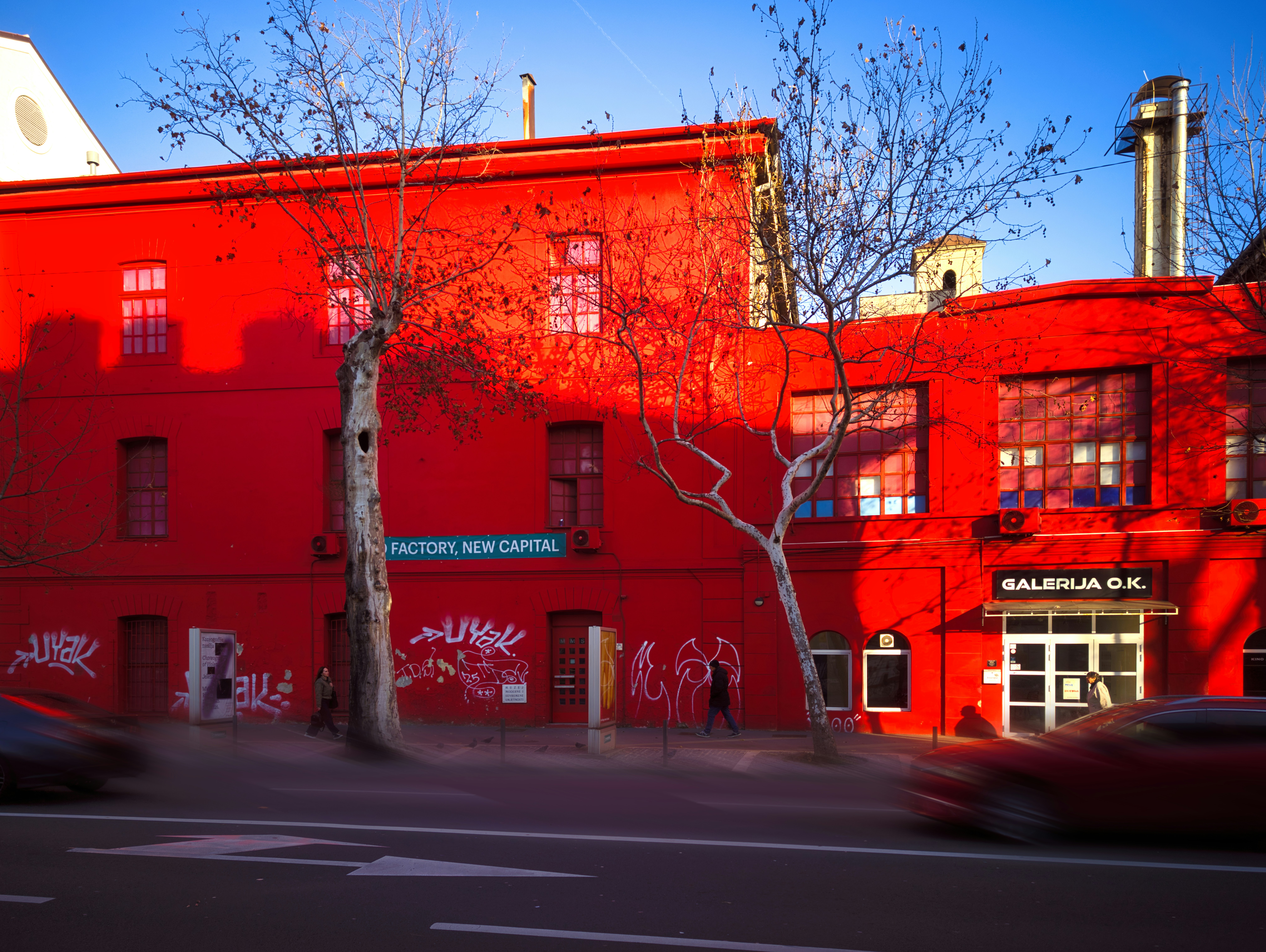 Crimson Facade at Dusk: A City Block in Bold Red